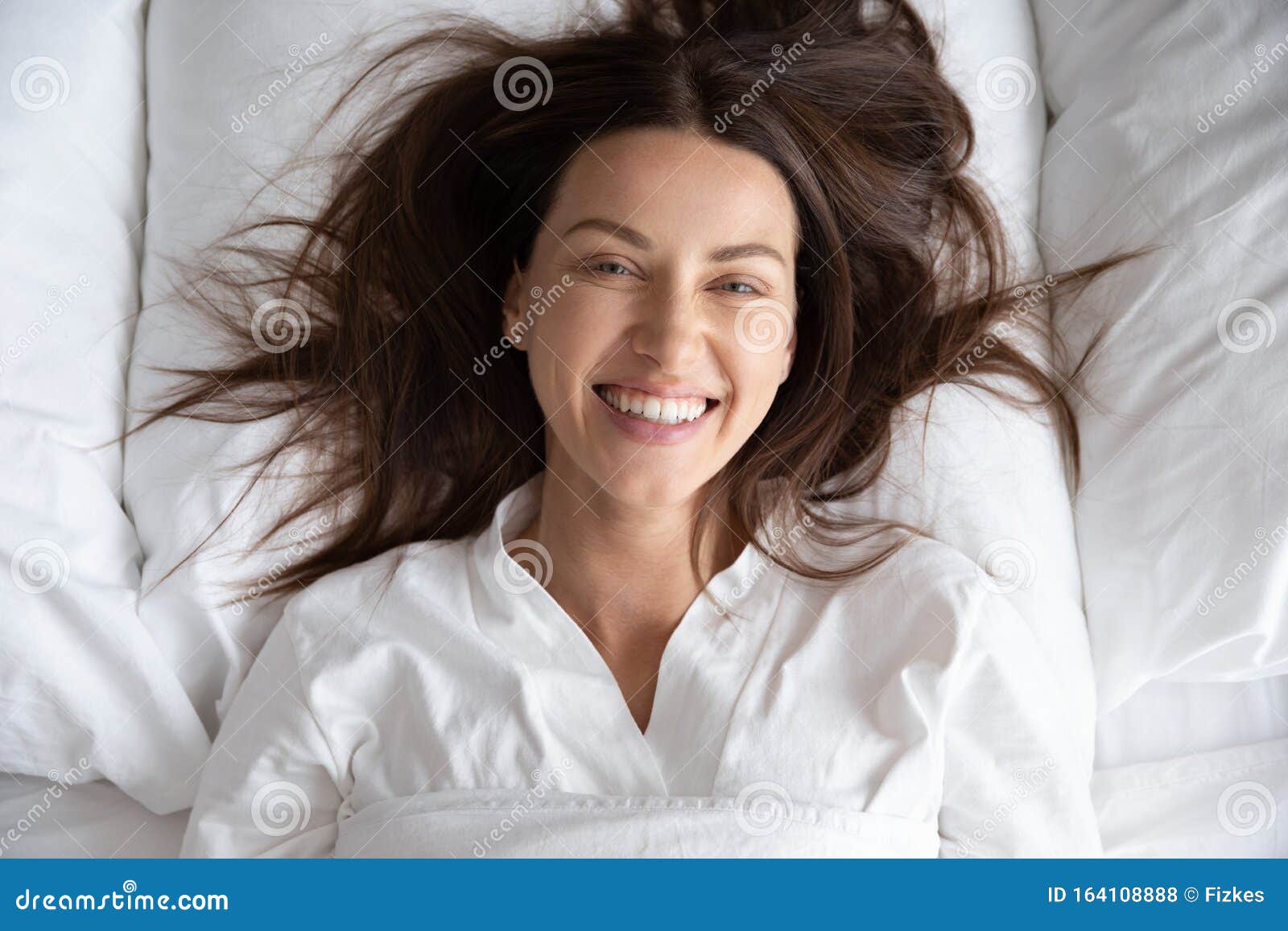Happy Beautiful Young Woman Waking Up in Bed, Top View Stock Photo ... Happy Beautiful Young Woman Waking Up in Bed, Top View Stock Photo ...