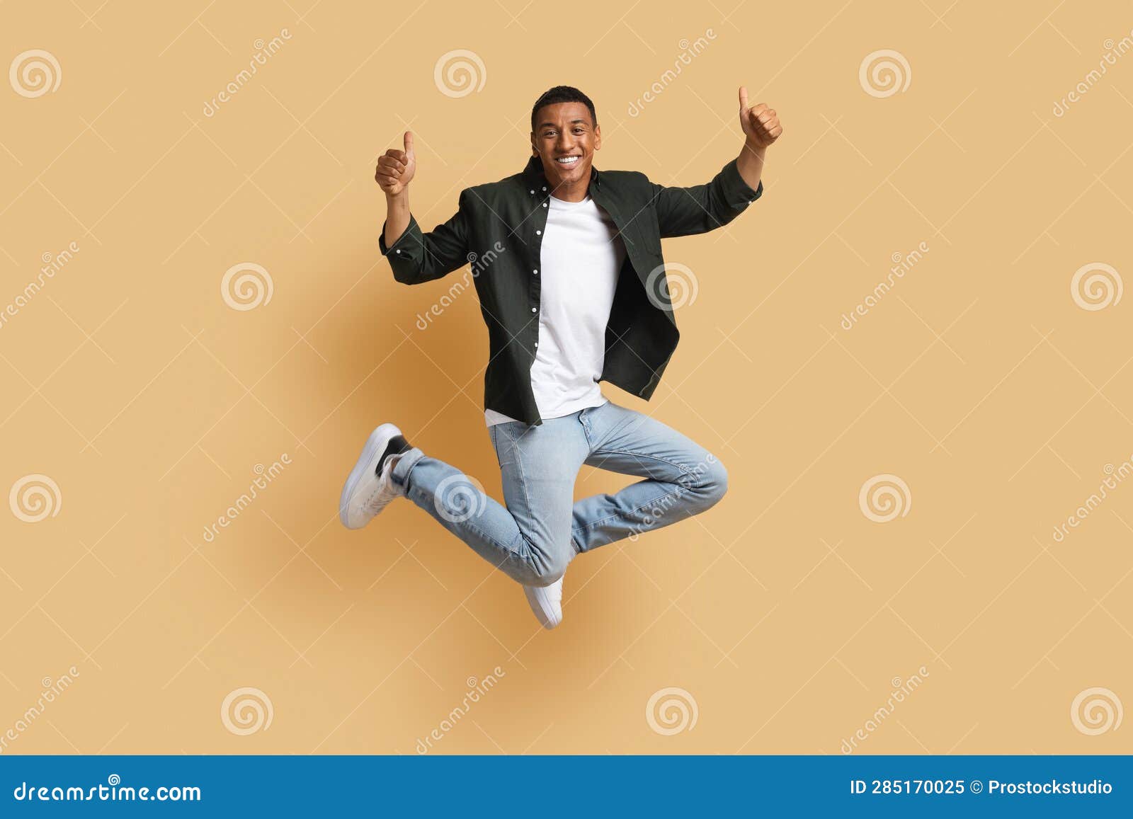 Happy Black Man Jumping Up and Showing Thumb Ups Stock Image - Image of ...