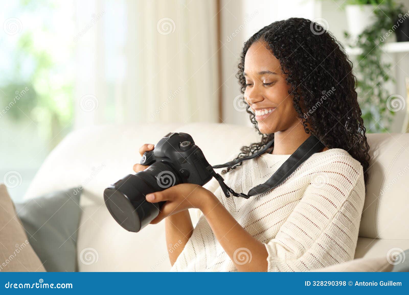 Happy Black Photographer Checking Camera at Home Stock Photo - Image of ...