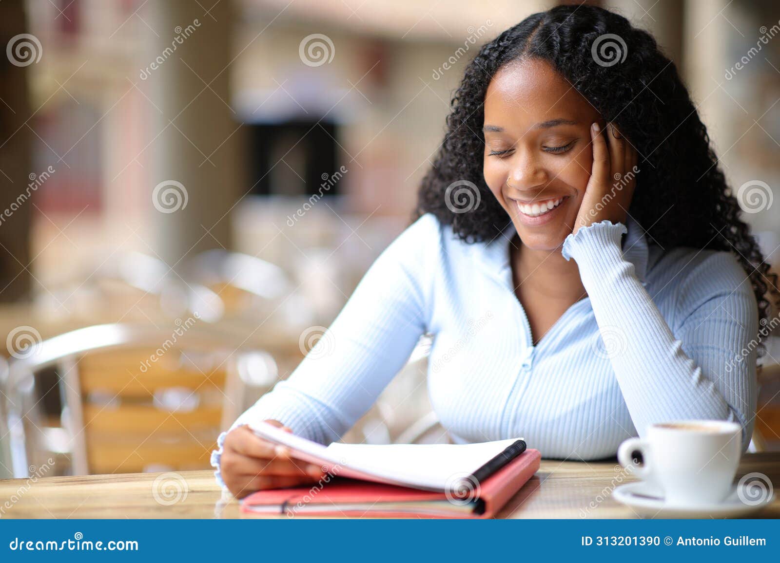 Happy Black Student Memorizing Notes in a Coffee Shop Stock Photo ...
