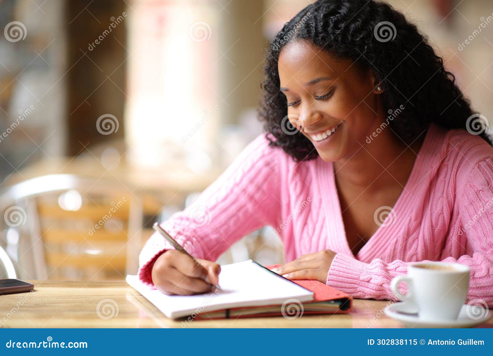 Happy Black Student Taking Notes Studying in a Bar Stock Image - Image ...