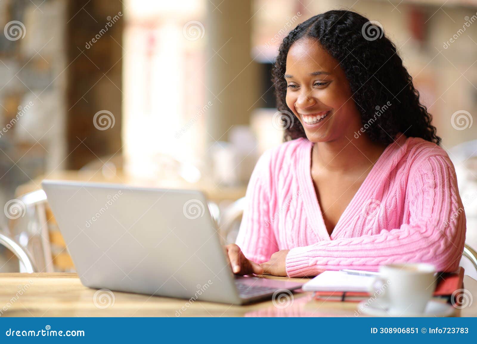 Happy Black Student Using Personal Computer in a Bar Stock Image ...