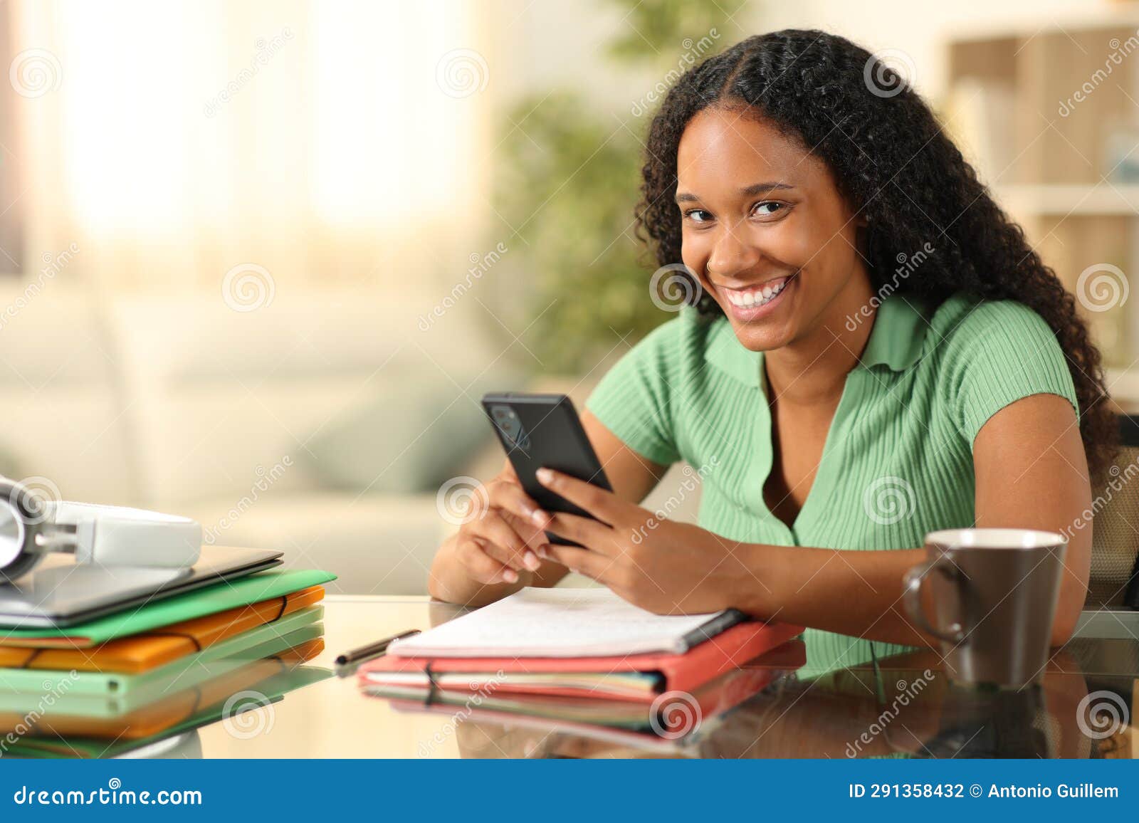 Happy Black Student Using Phone Looking at You Stock Photo - Image of ...
