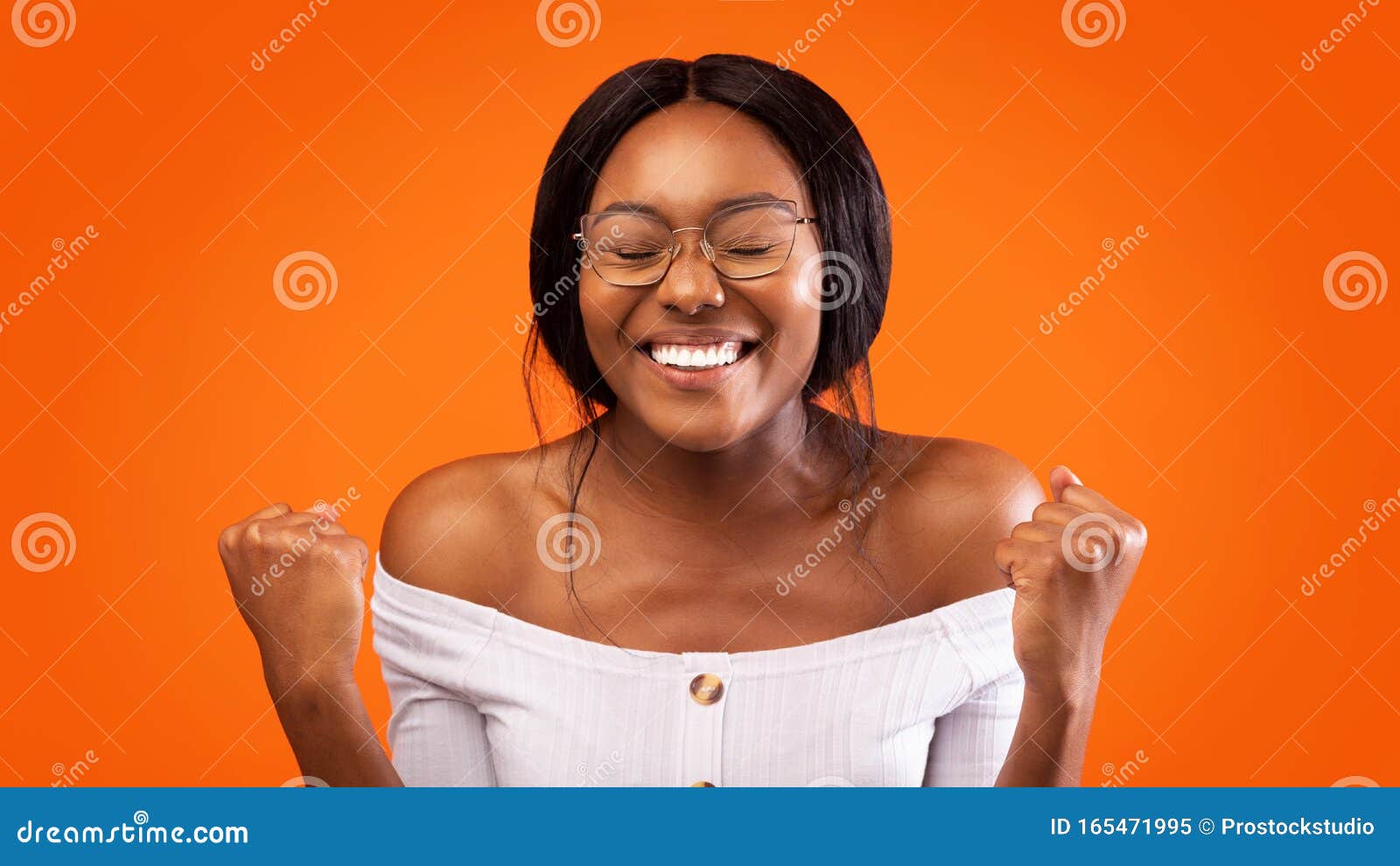 Happy Black Afro Girl Poses Looking At The Camera And Laughing With