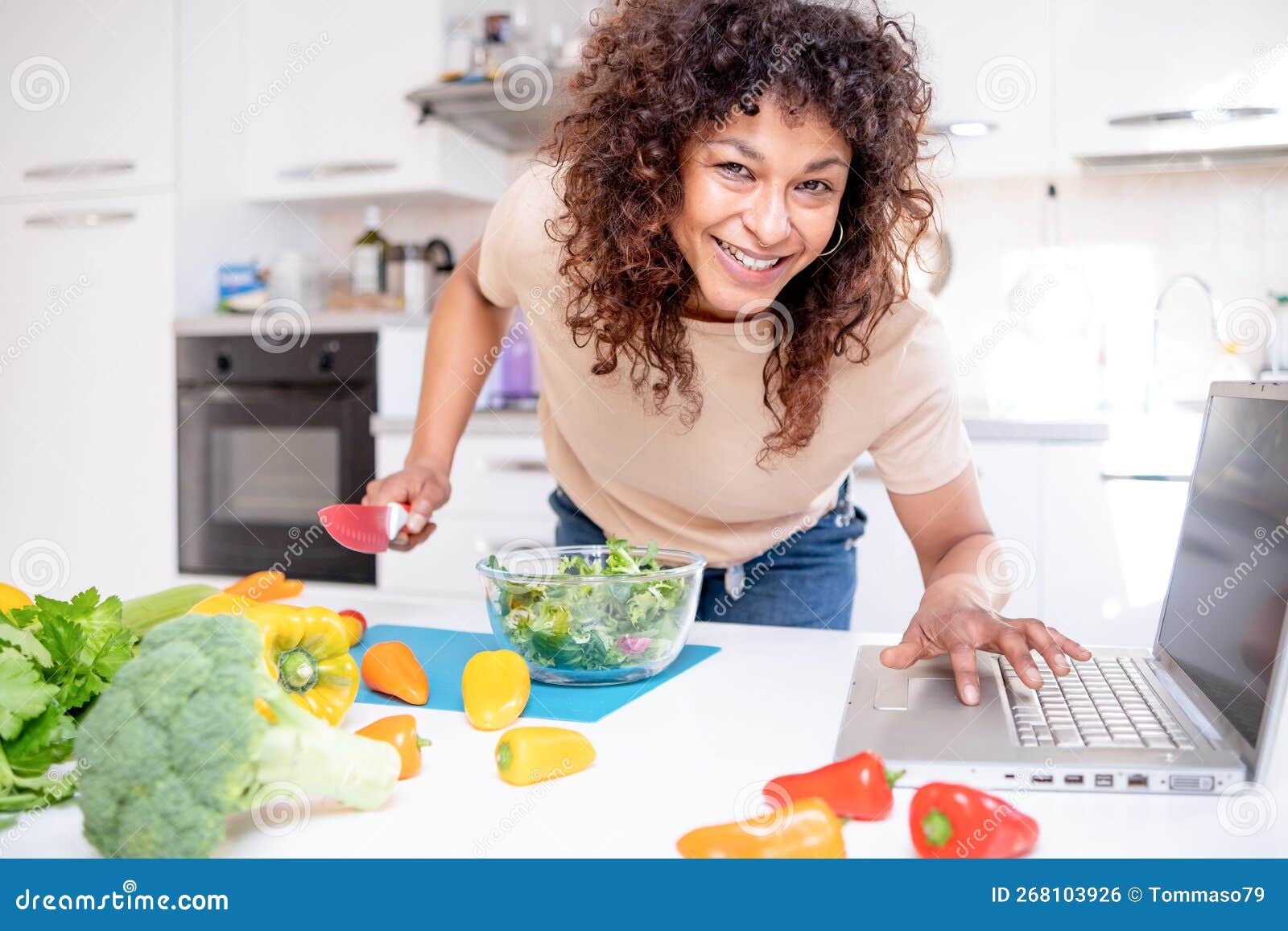 Happy Black Woman Learning To Cook at Home with Online Courses Stock ...