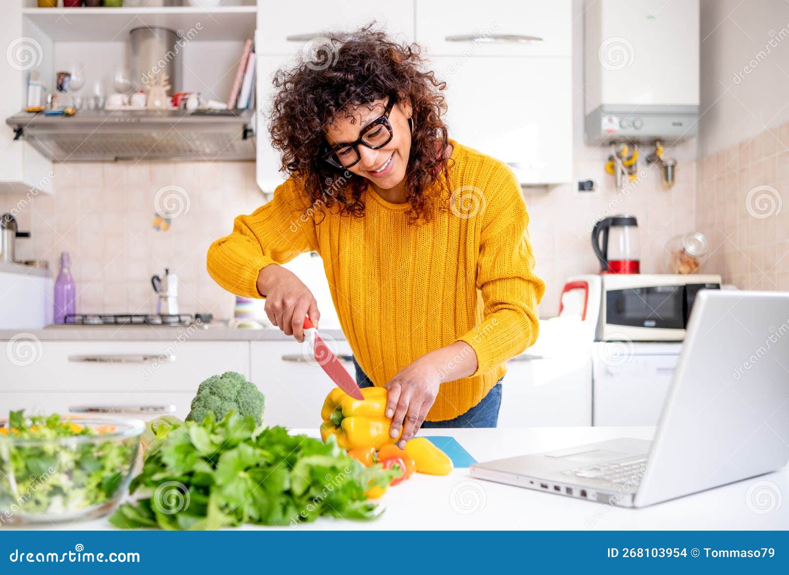 Happy Black Woman Learning To Cook at Home with Online Courses Stock ...