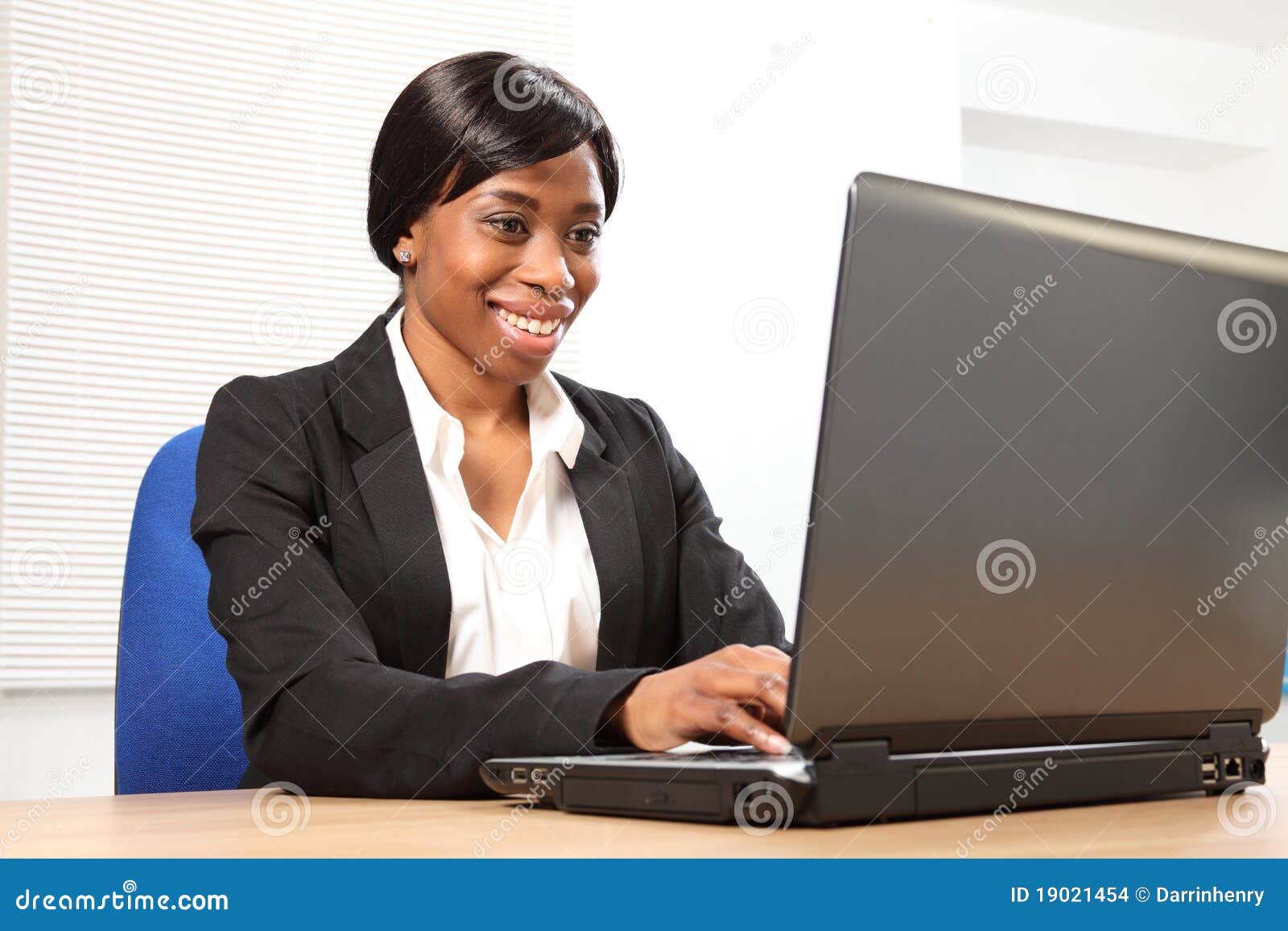 Black Woman Working At Desk