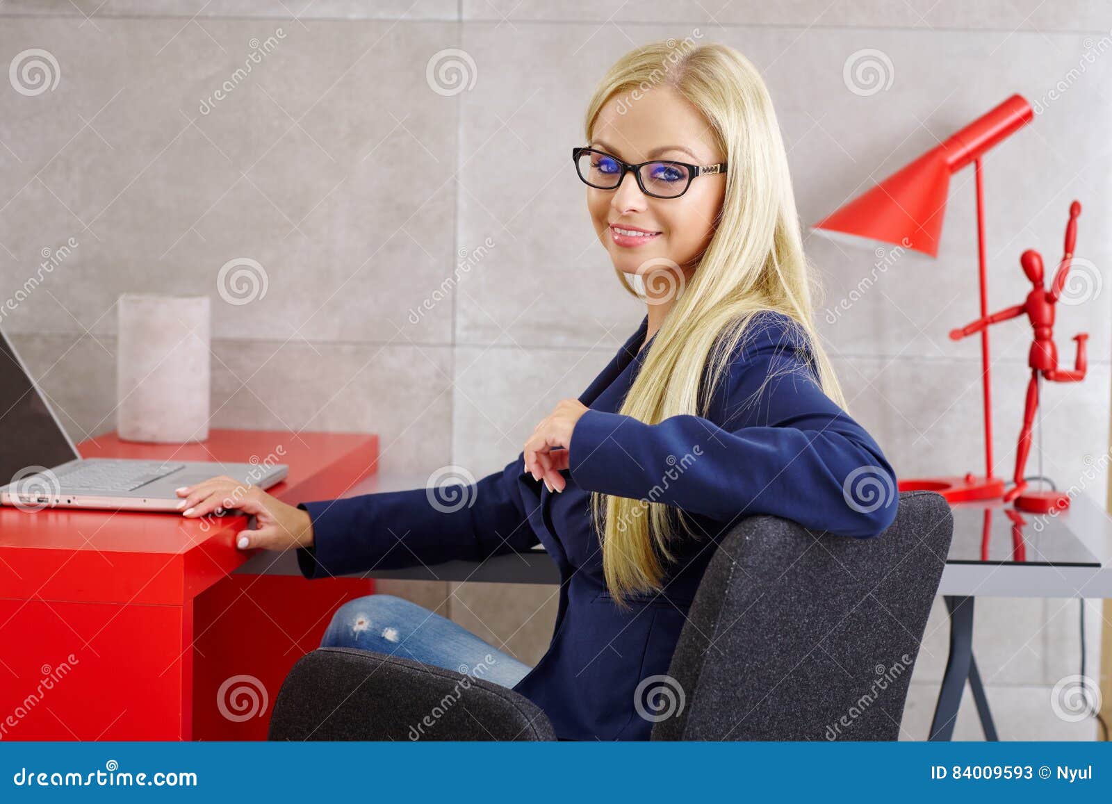 Happy blonde with laptop stock image. Image of color - 84009593