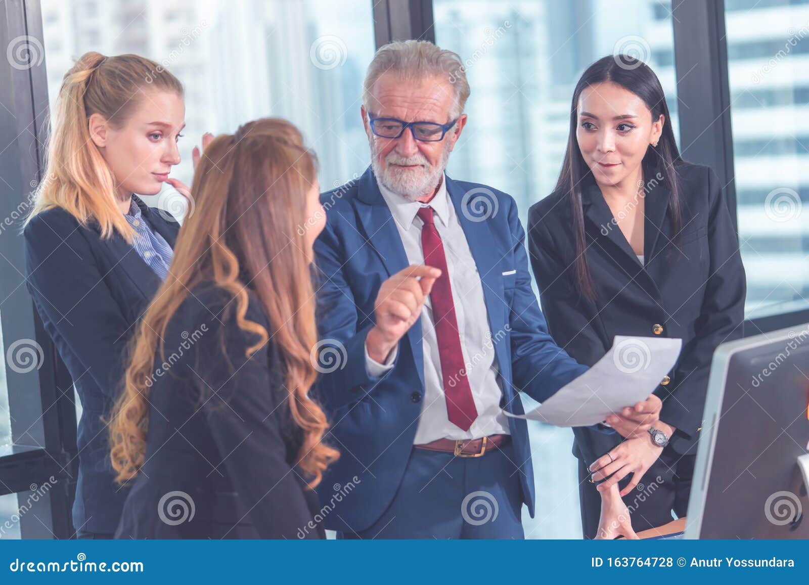 A Happy Boss Helping Officer in Multiculture Office Stock Photo - Image ...