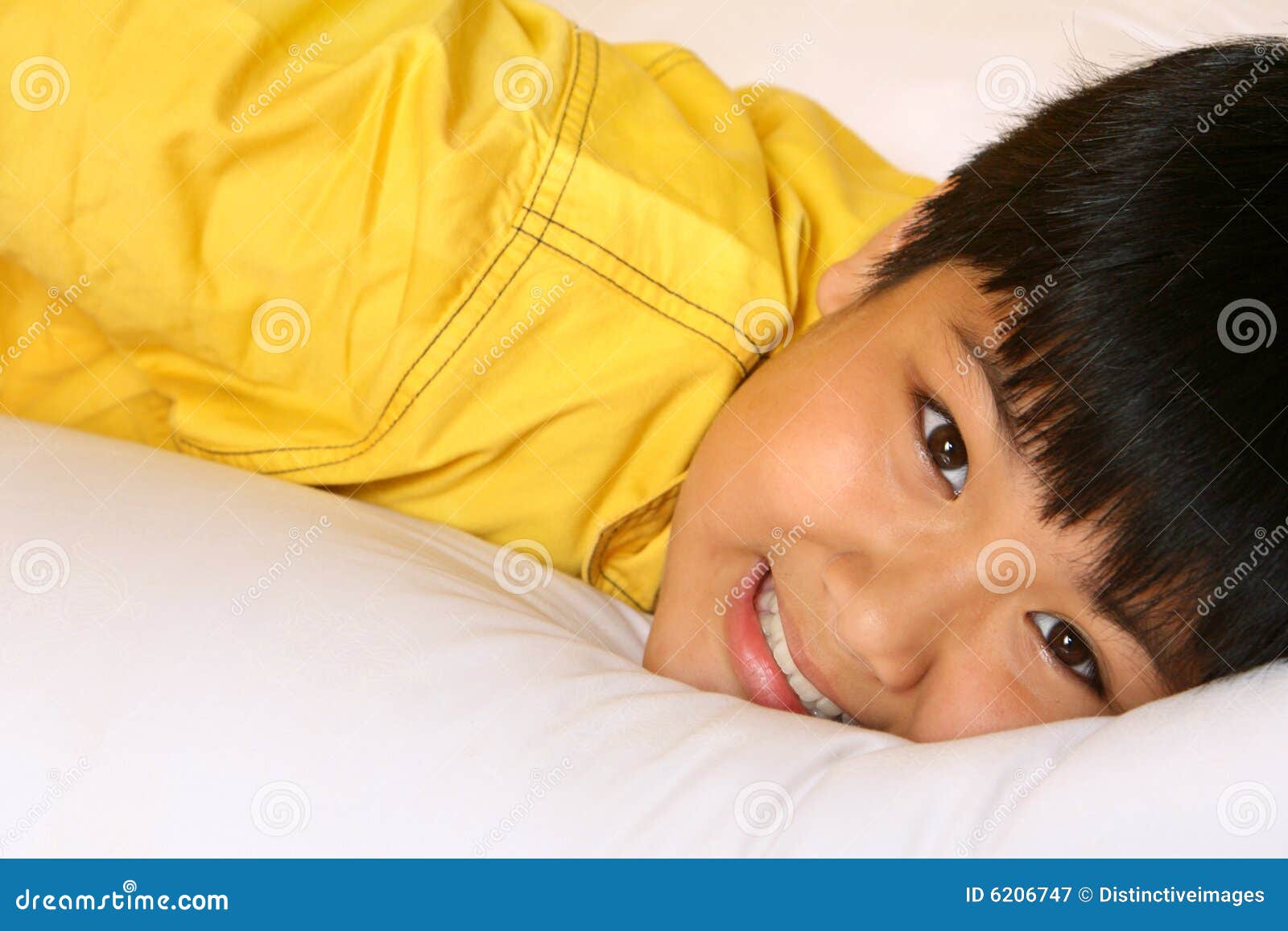 Happy Boy stock image. Image of cute, smile, pillow, young - 6206747