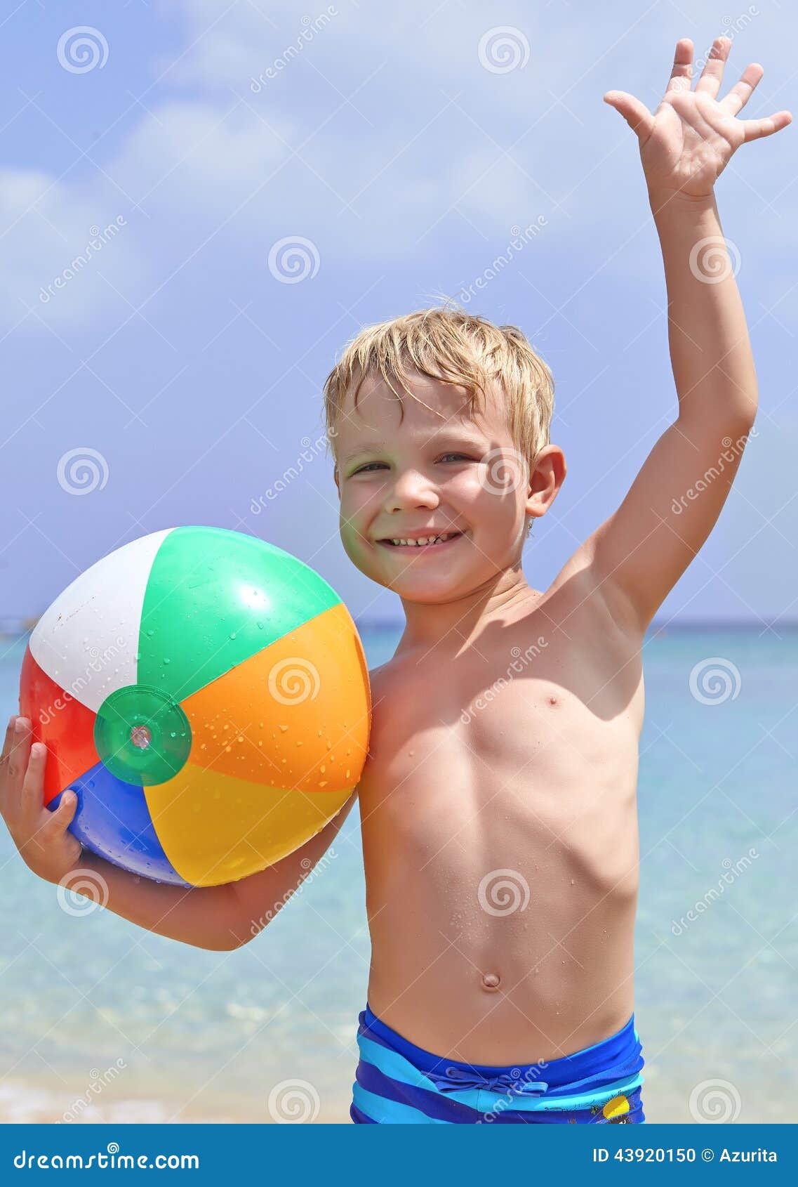 Happy boy with beach ball stock photo. Image of summer - 43920150