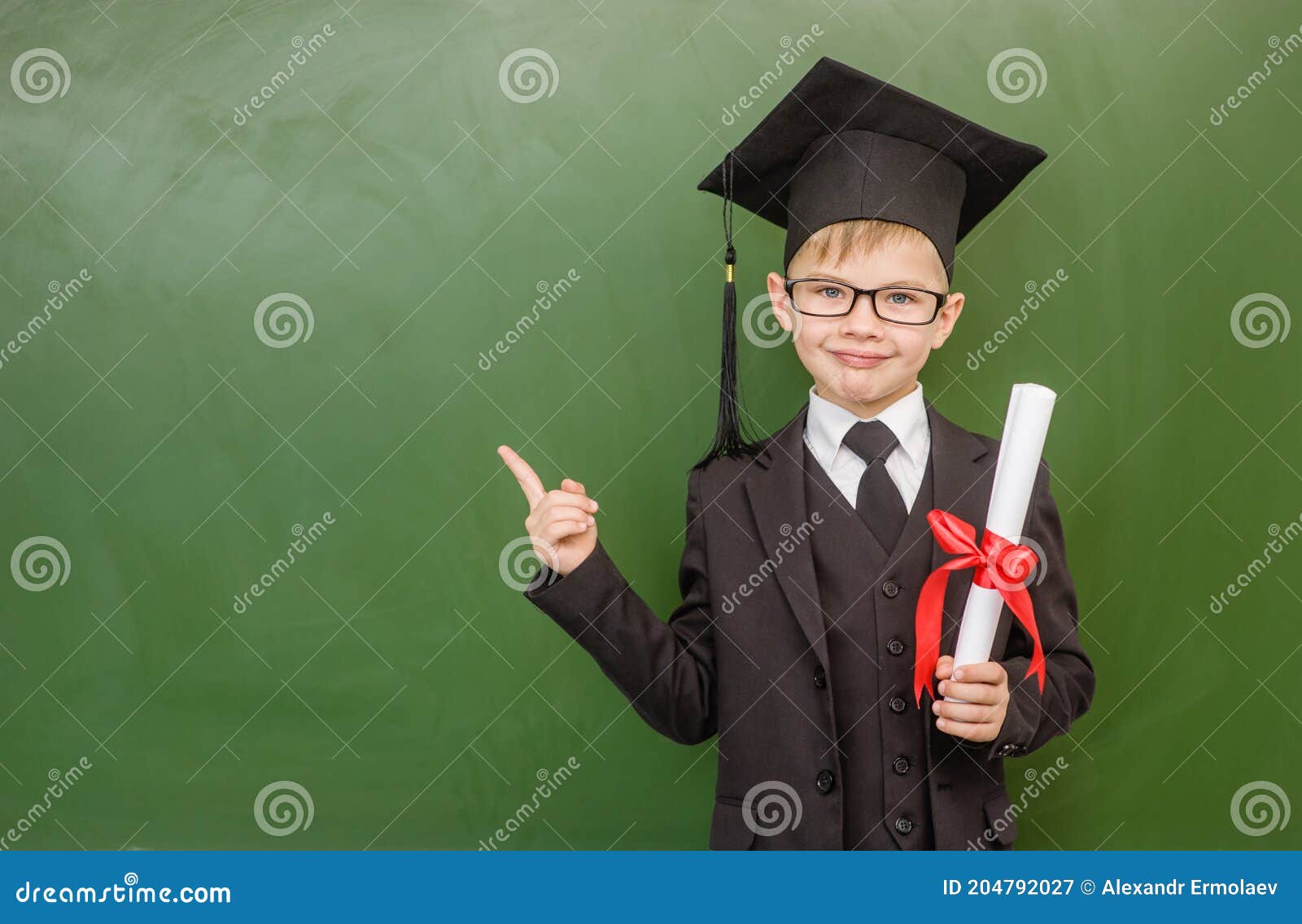 Happy Boy with Diploma in Graduation Hat Points on Empty Green ...