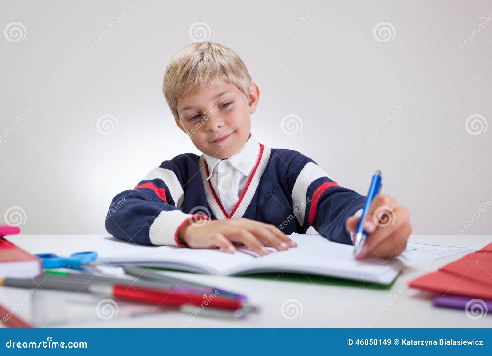 Happy boy doing homework stock image. Image of child - 46058149