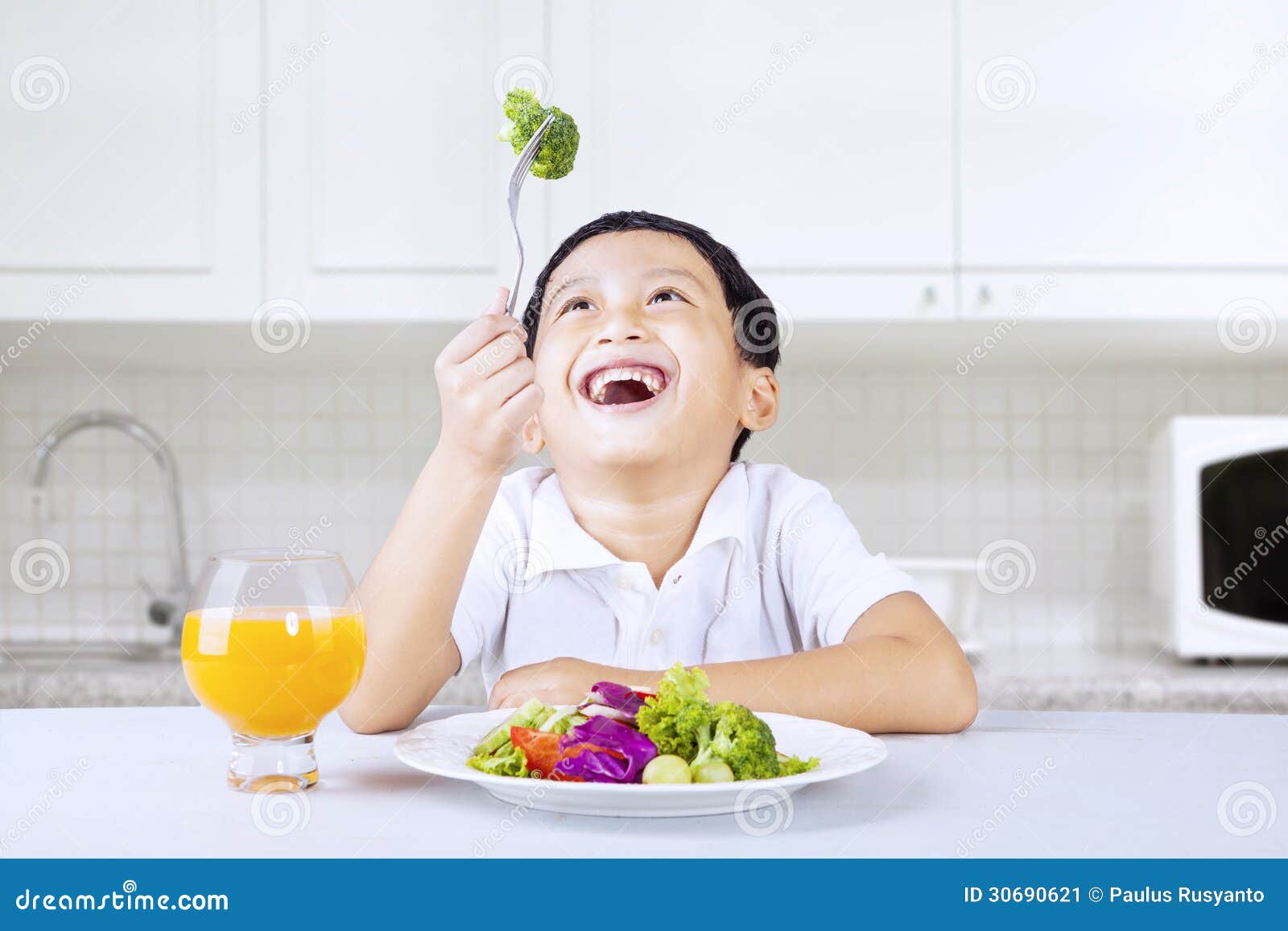 Happy Boy Eat Brocoli in Kitchen Stock Image - Image of asian, organic ...