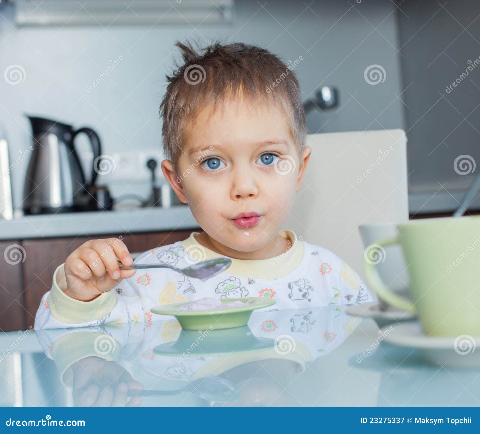 Happy Boy Eating Breakfast stock image. Image of expression - 23275337