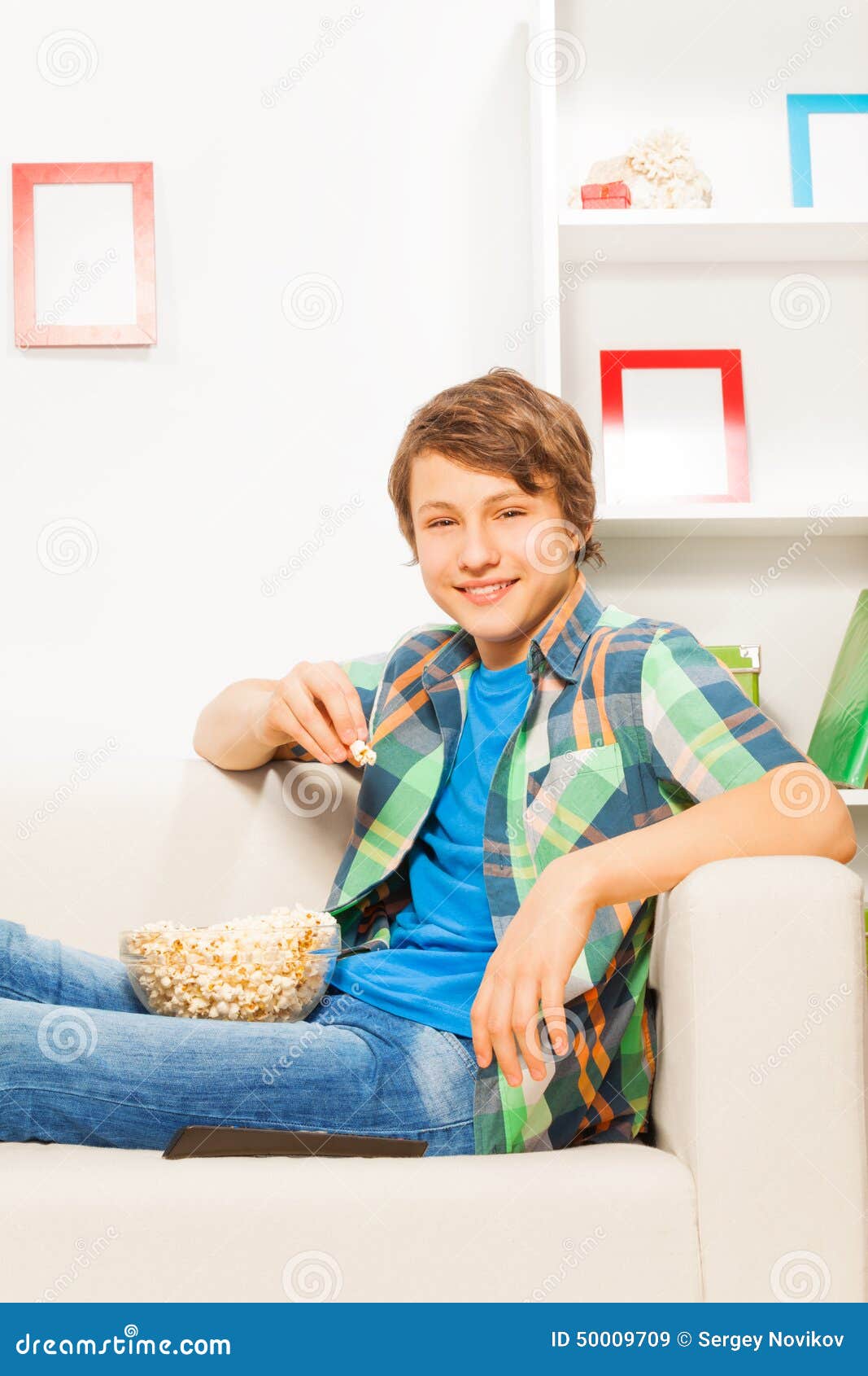 Happy Boy Eating Popcorn while Sitting on Sofa Stock Image - Image of ...