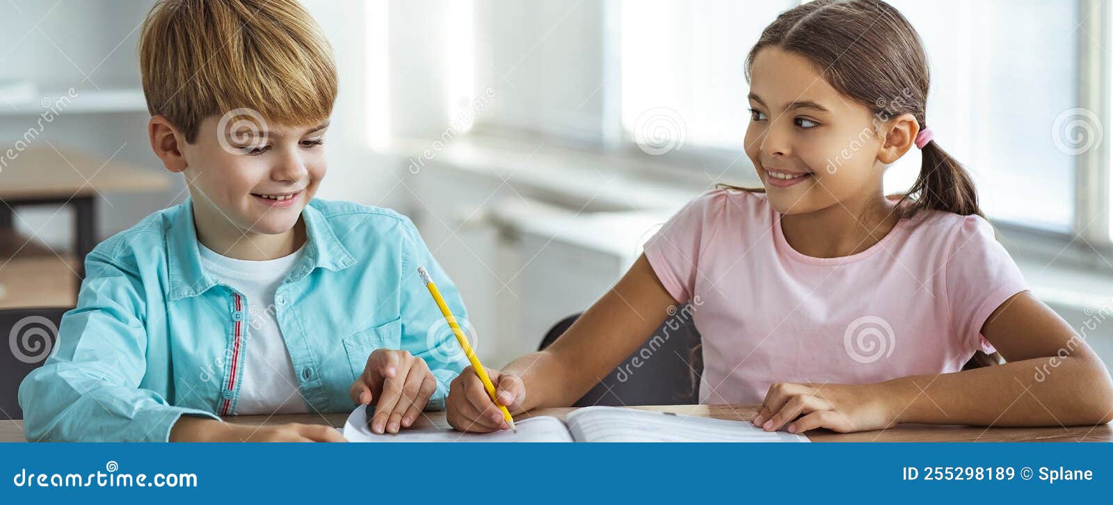 The Happy Boy and a Girl Doing Homework at the Desk. Stock Image ...