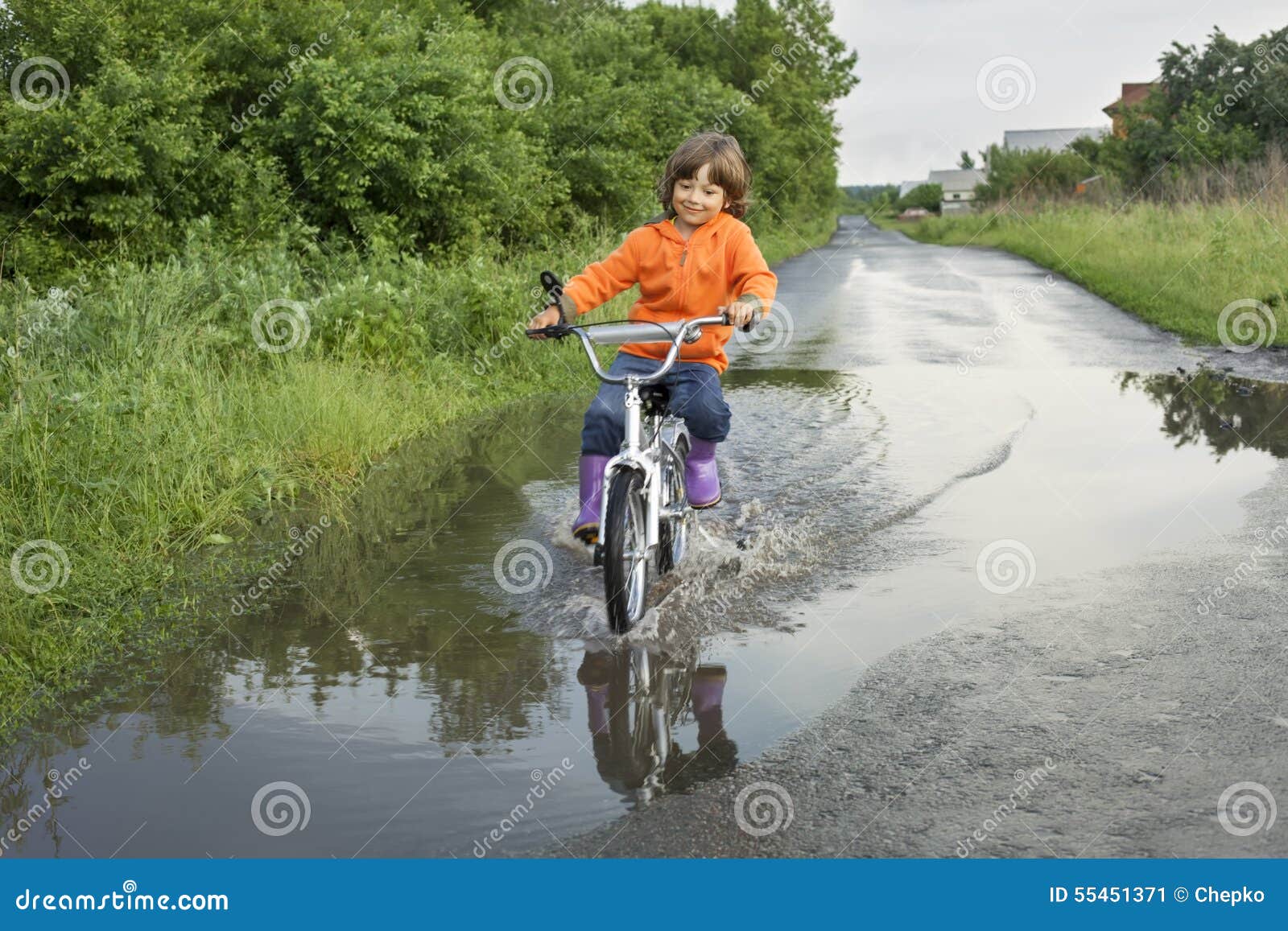 Happy Boy Going through a Puddle Stock Image - Image of happiness ...