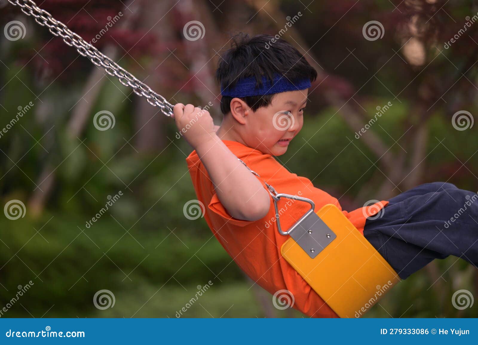 Boy have a ride on a swing stock photo. Image of yellow - 279333086