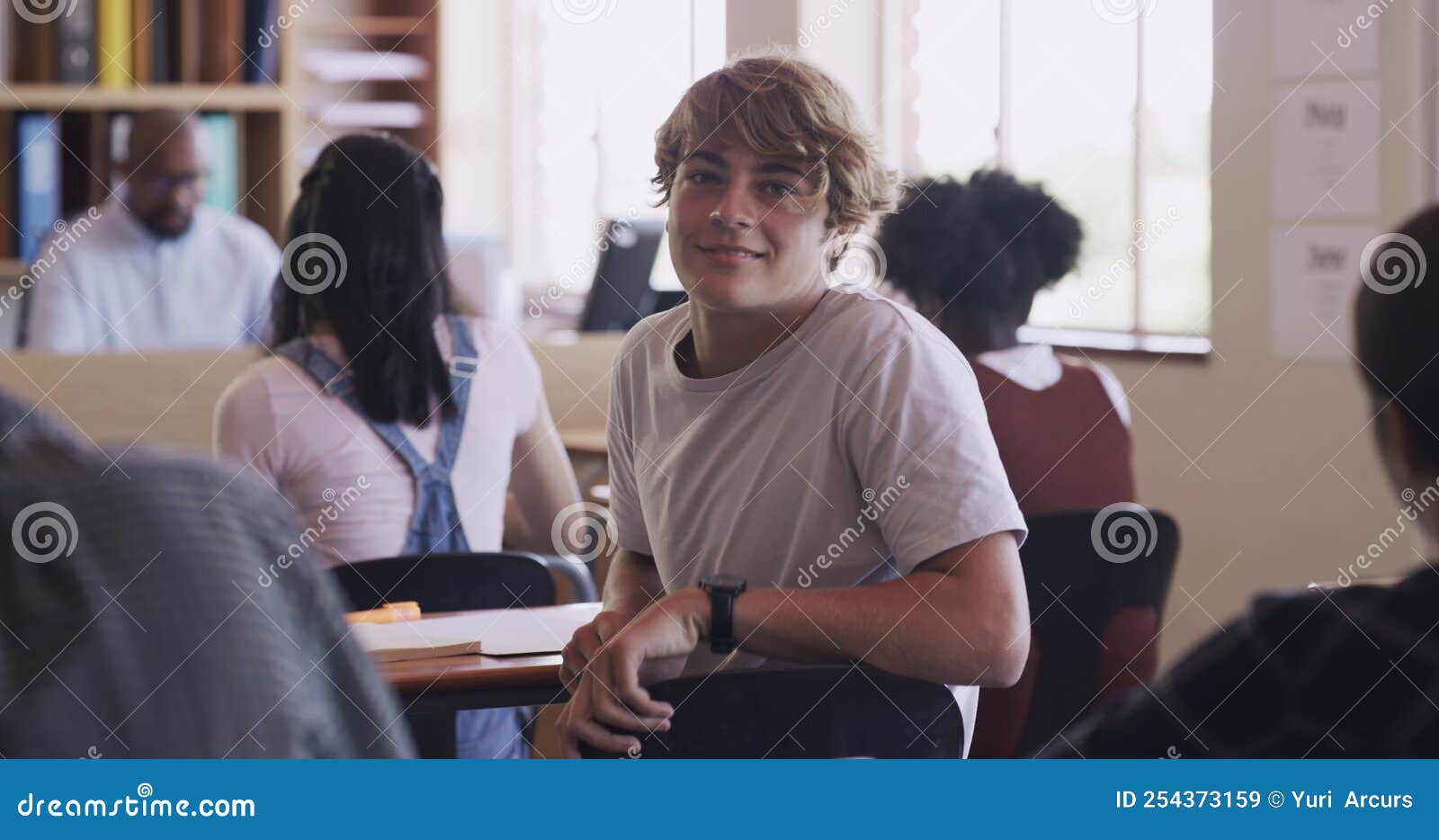 Happy Boy High School Student Learning in a Classroom Getting an ...