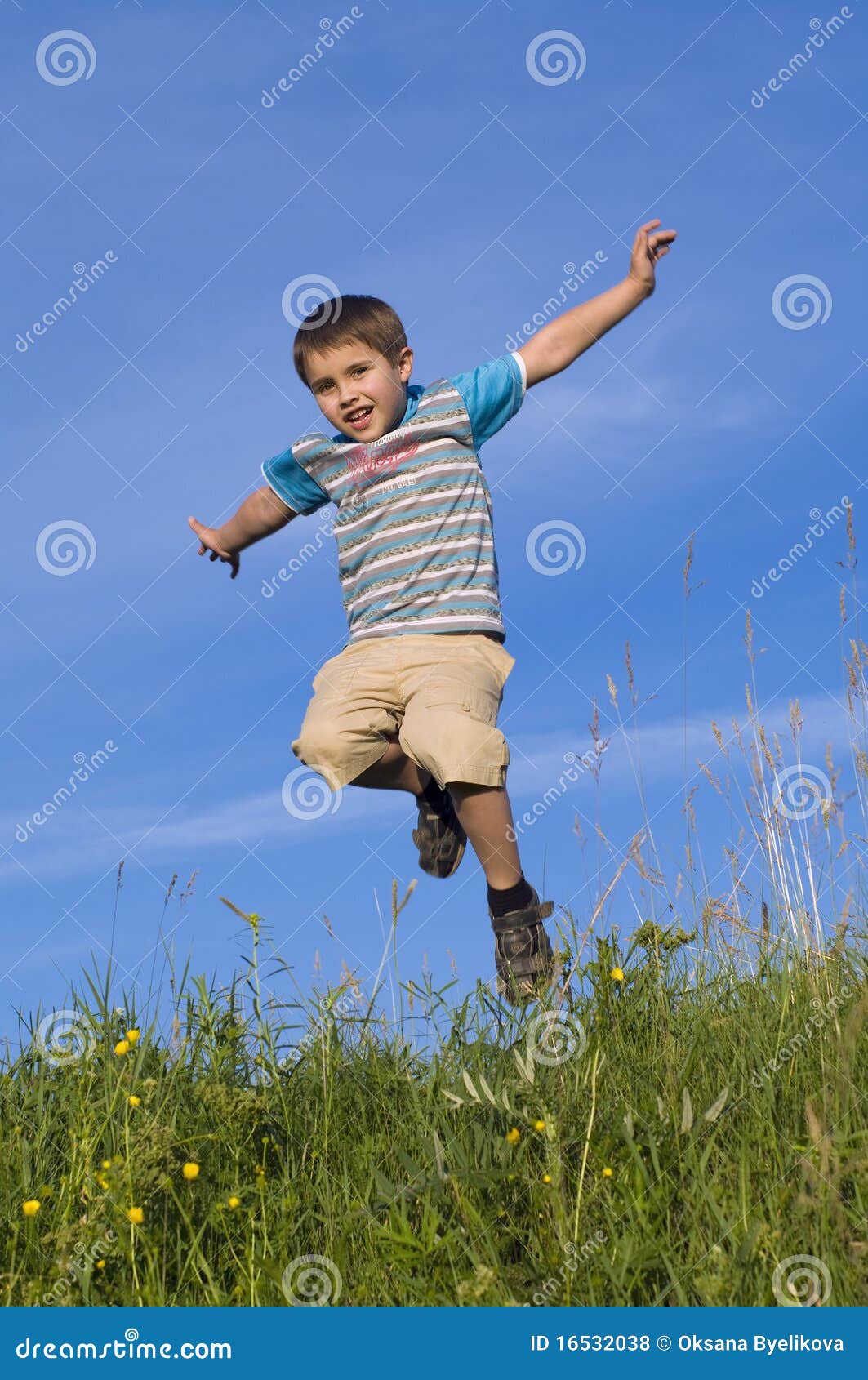 Happy boy jumping stock photo. Image of hilltop, color - 16532038
