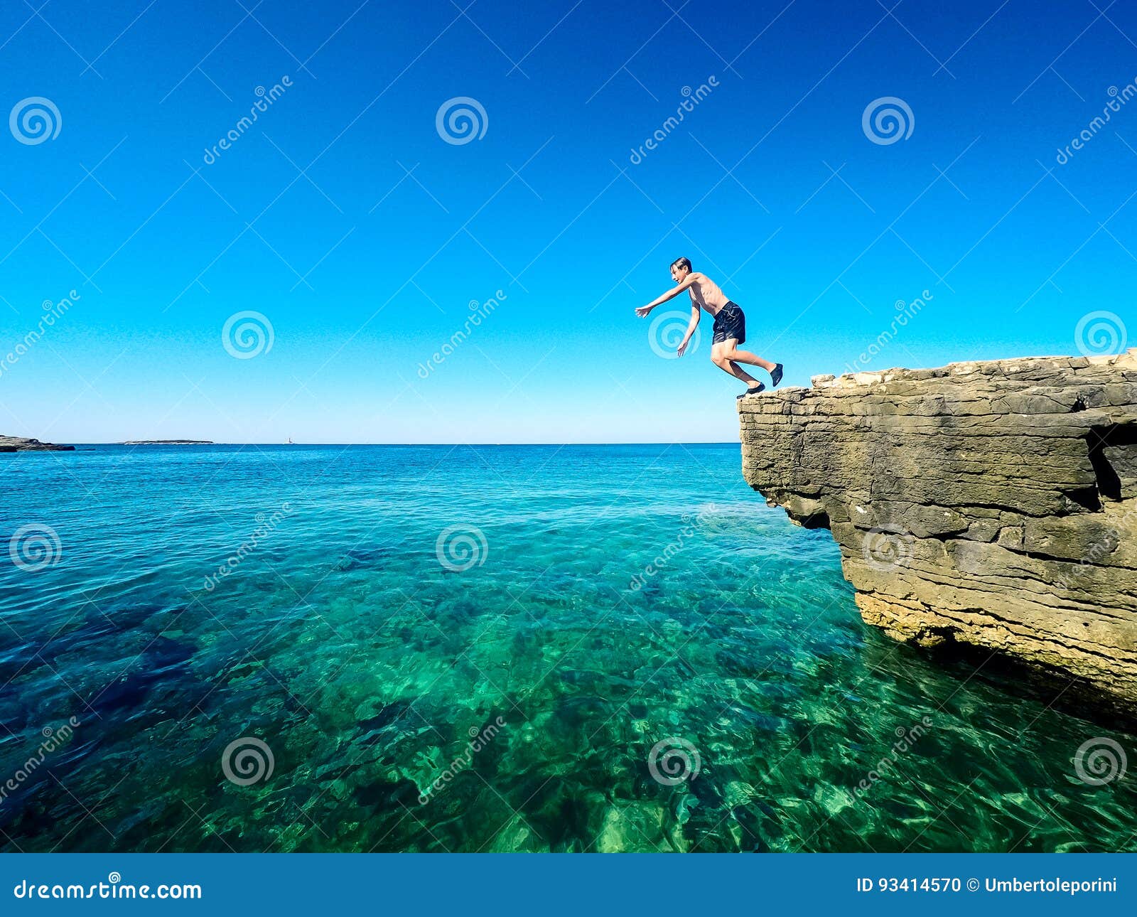 Happy Boy Jumping in the Sea Stock Photo - Image of croatian, blue ...