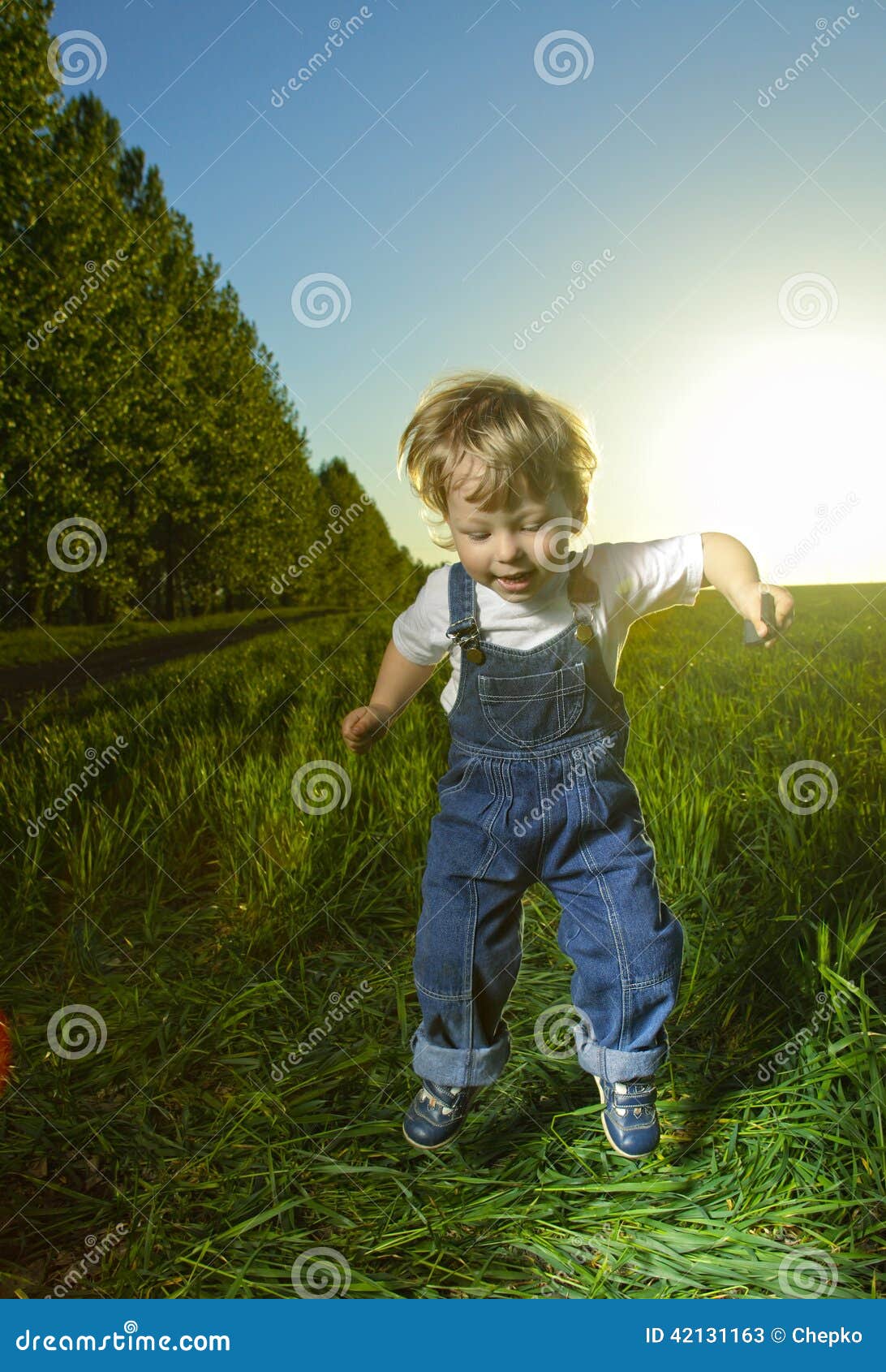 Happy boy jumping stock image. Image of cloud, childhood - 42131163
