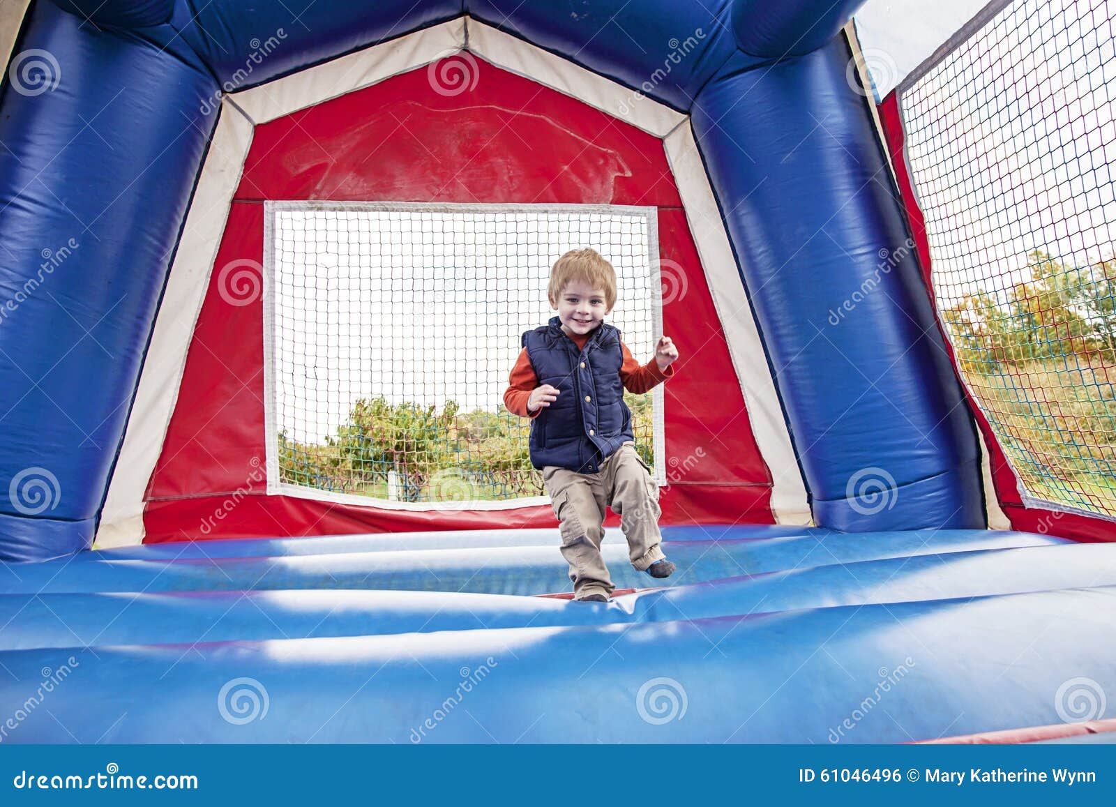 Happy boy jumping stock photo. Image of playing, toddler - 61046496