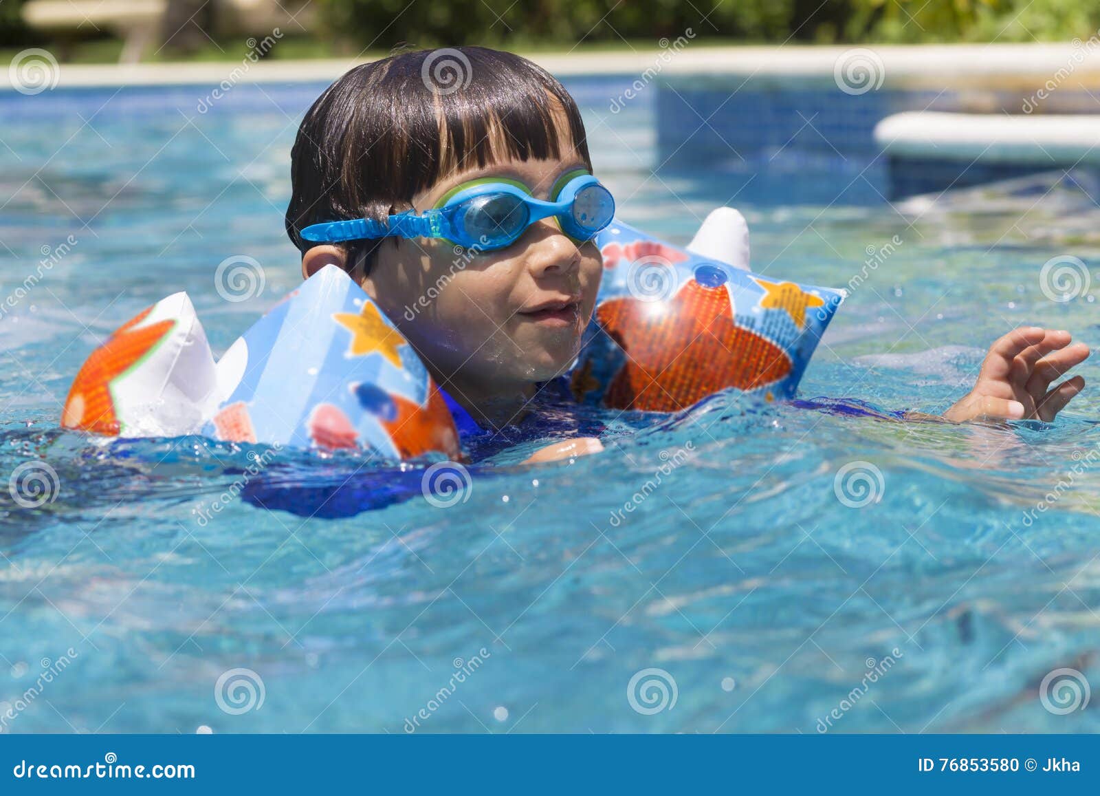 Happy Boy learning to swim stock photo. Image of hotel - 76853580