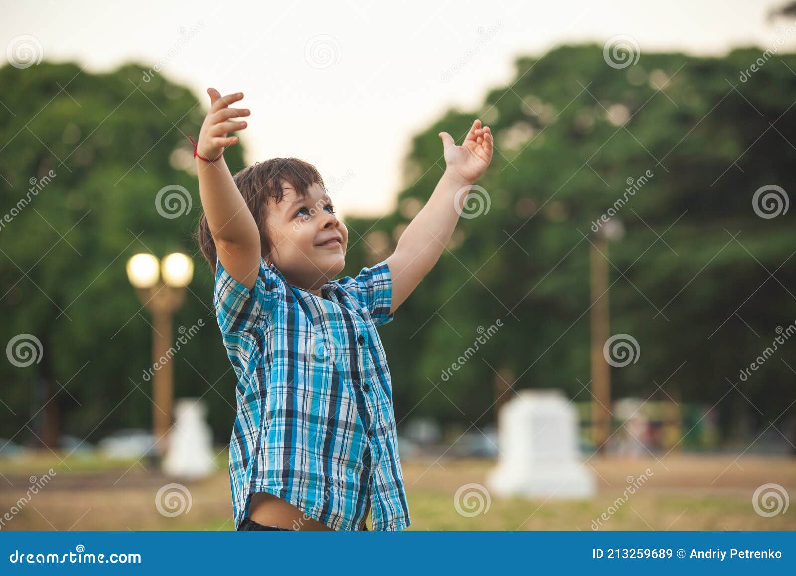 Boy with Outstretched Hands To the Sky in the Park Stock Image - Image ...