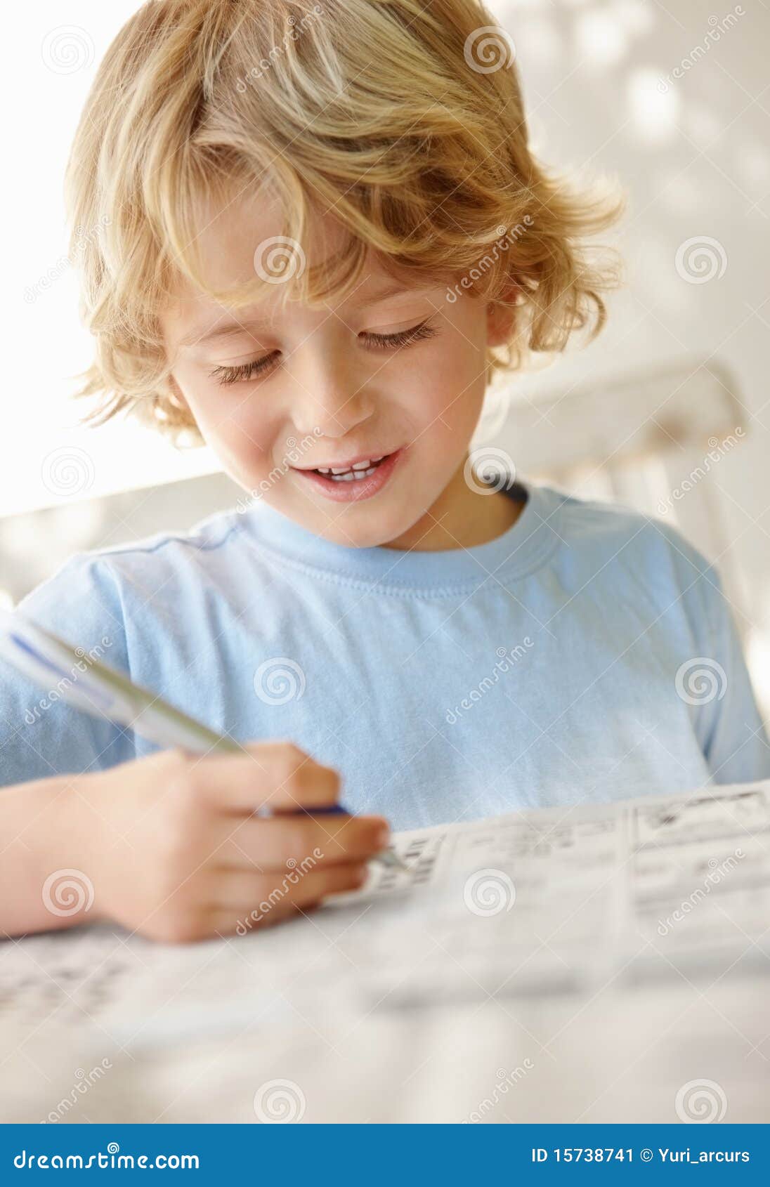 Happy Boy with Pen Writing Something on Newspaper Stock Image - Image ...
