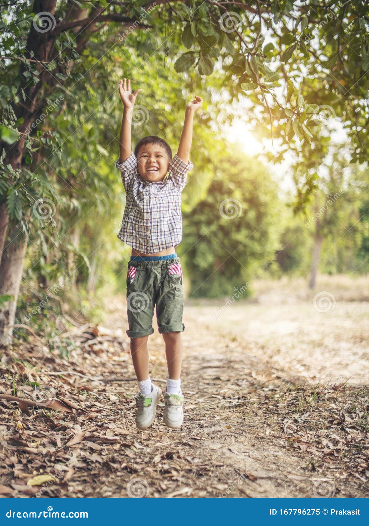 Happy boy playing alone stock image. Image of beautiful - 167796275