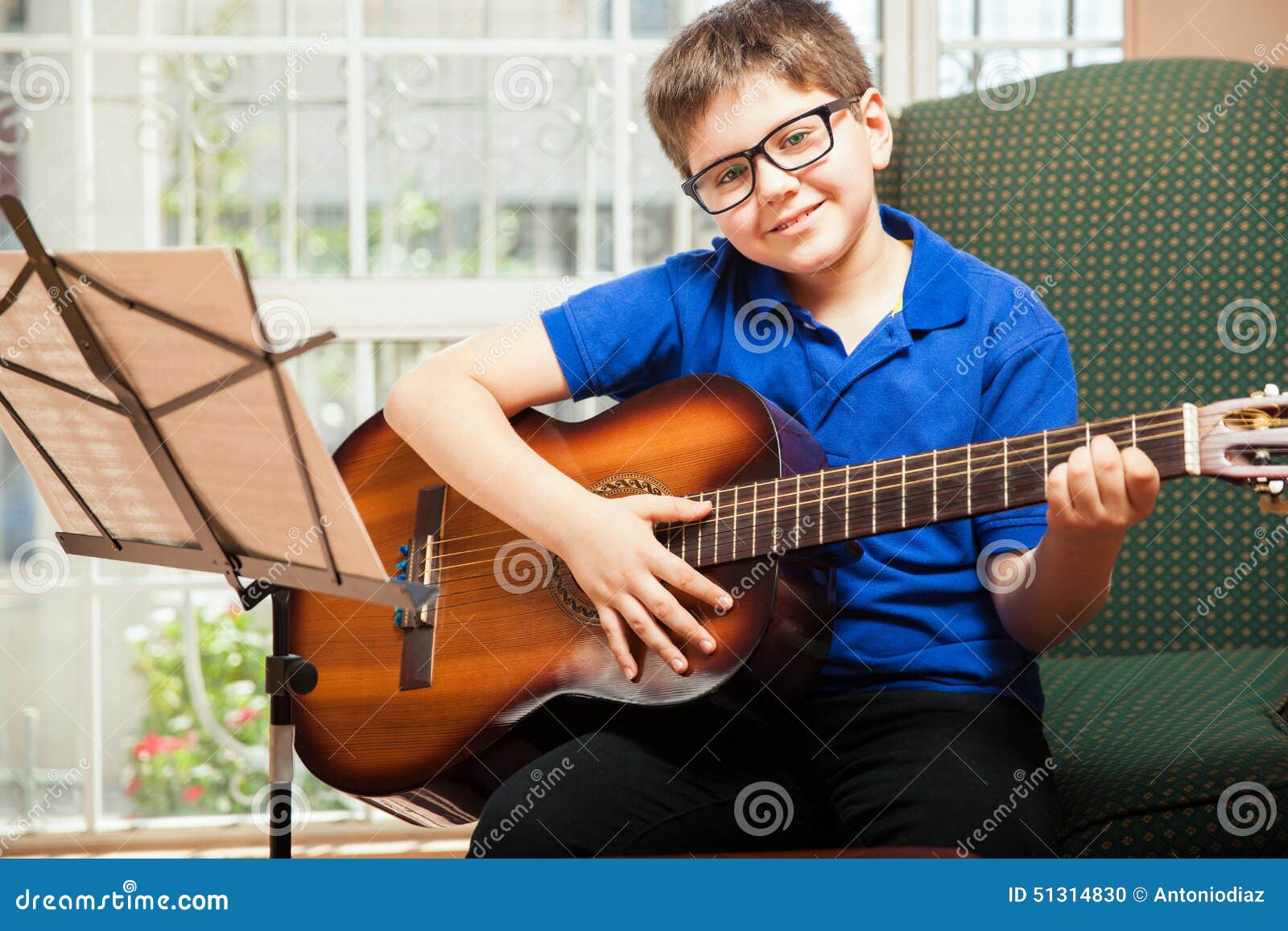 Happy Boy Playing the Guitar Stock Photo - Image of practicing, mixed ...