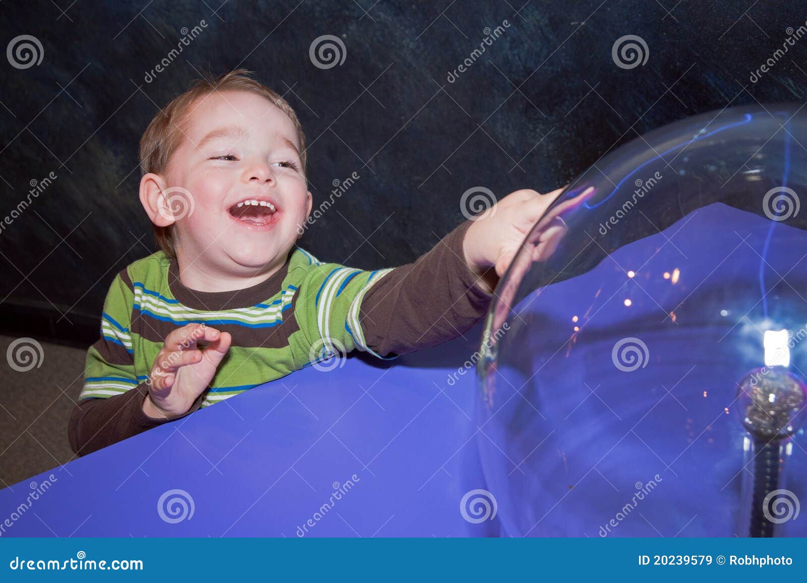 Happy Boy Playing with Static Electricity Machine Stock Image - Image ...
