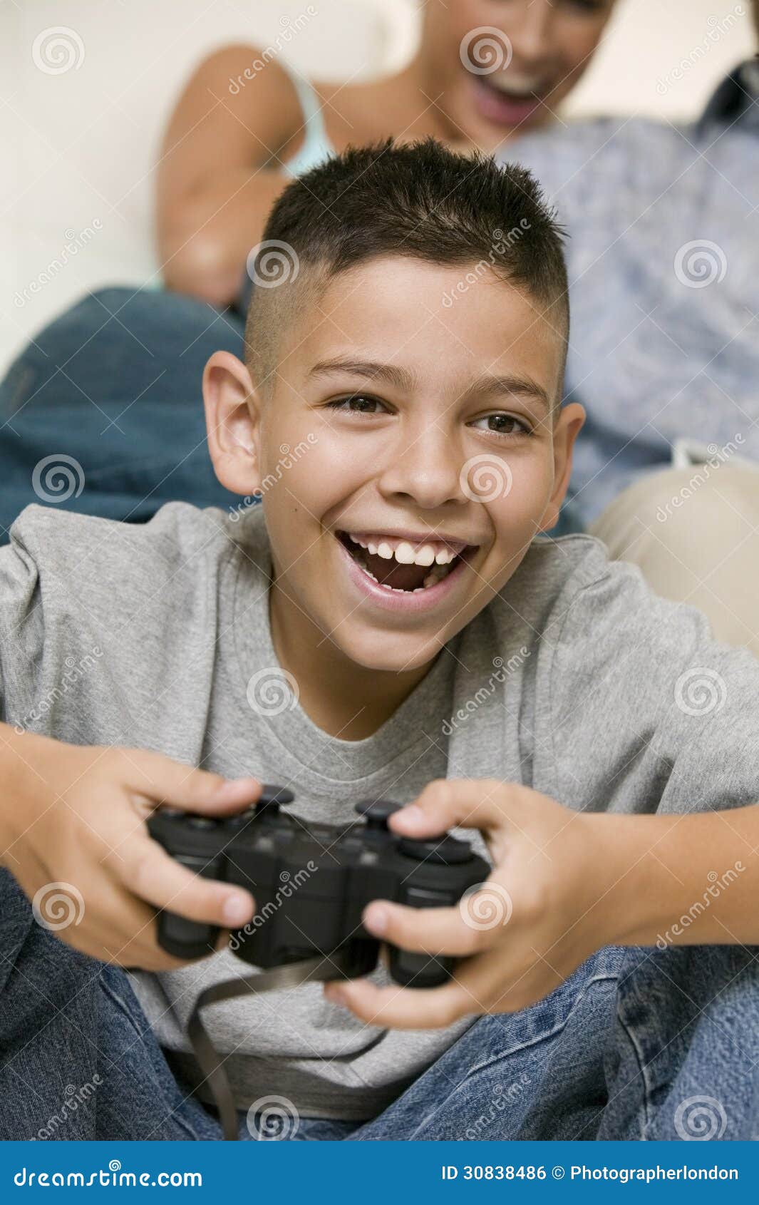 Happy Boy Playing Video Games at Home Stock Photo - Image of california ... Happy Boy Playing Video Games at Home Stock Photo - Image of california ...