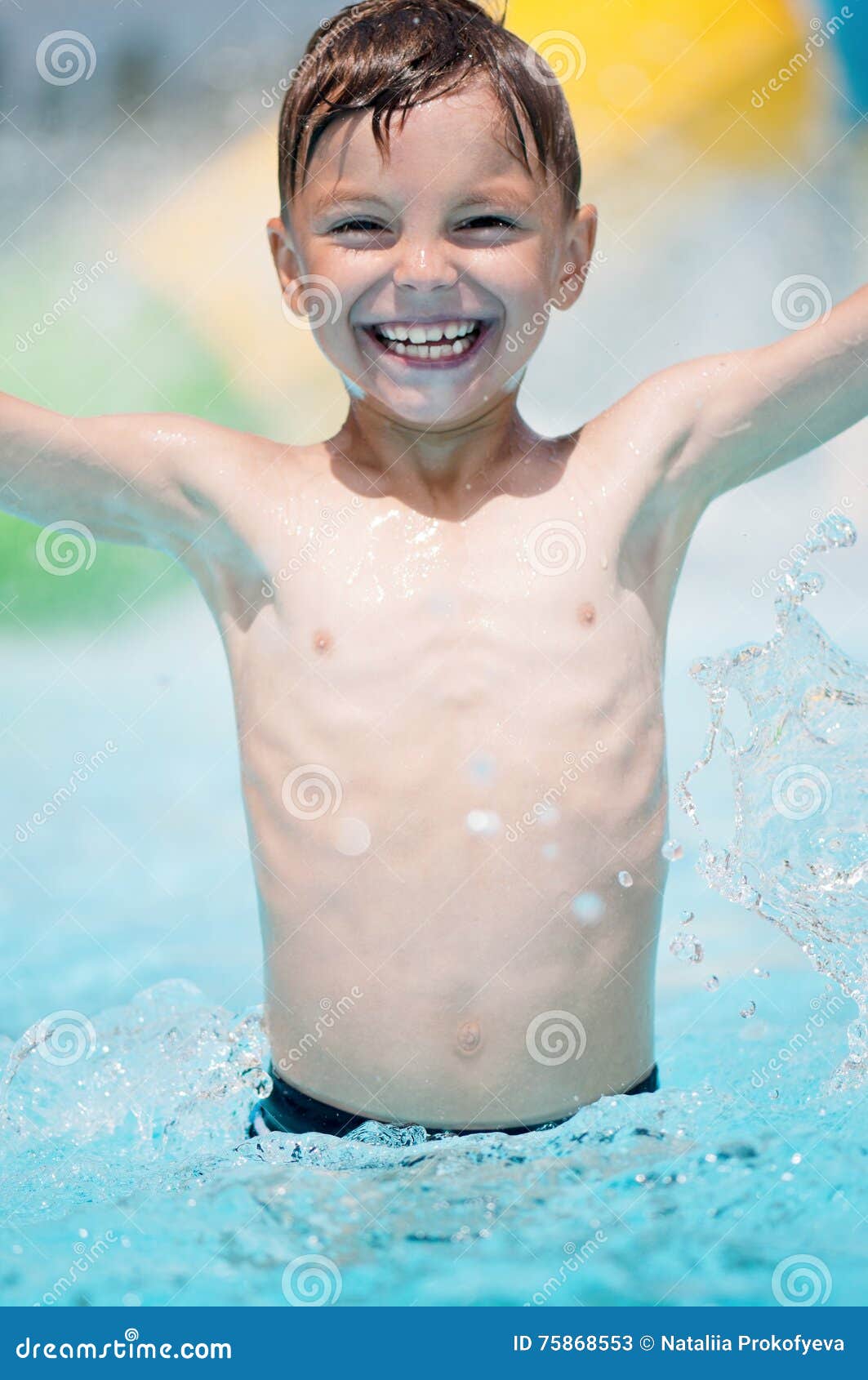 Happy boy in pool stock image. Image of float, hair, hands - 75868553