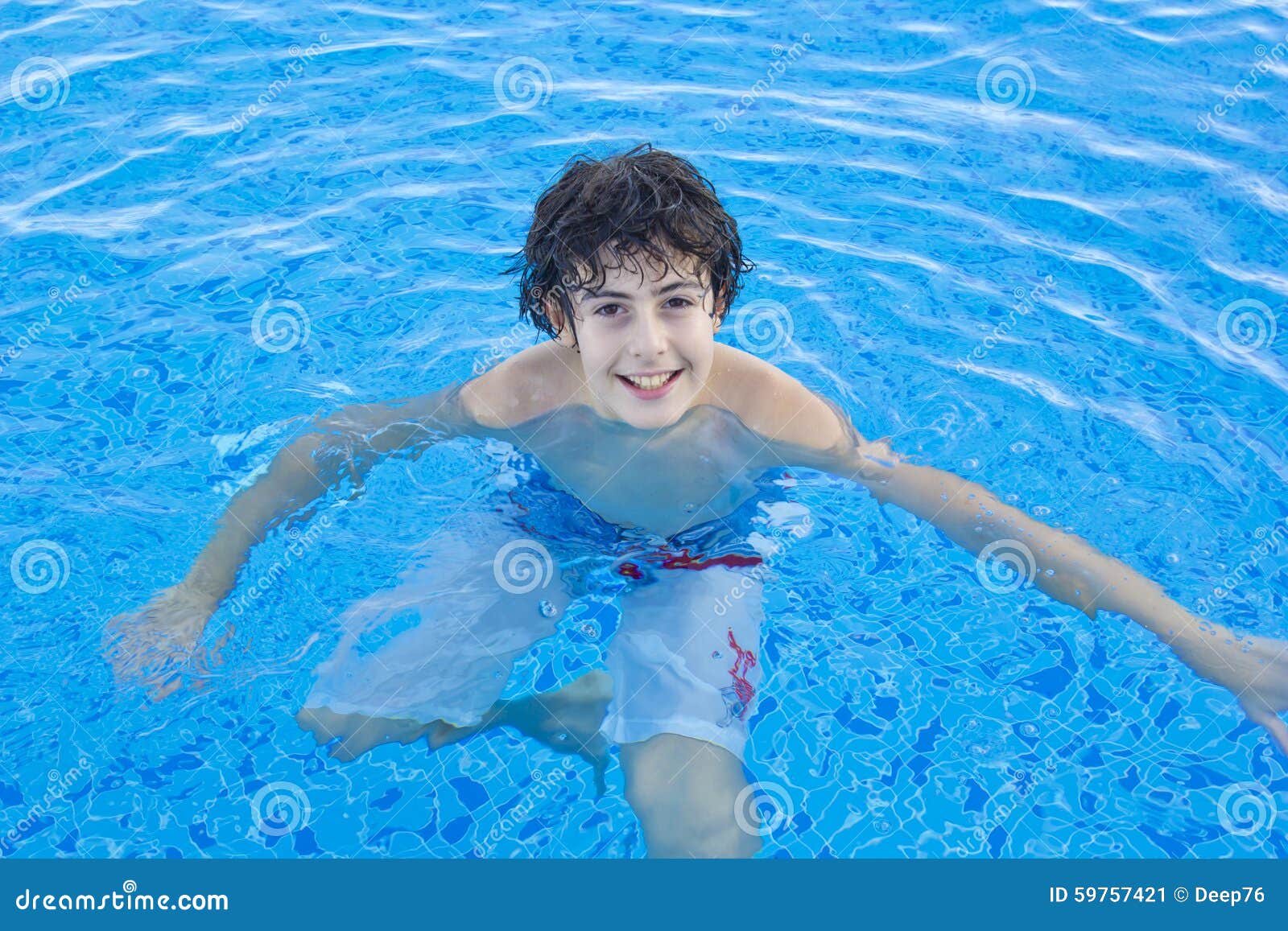 Happy boy in the pool stock image. Image of swimming - 59757421