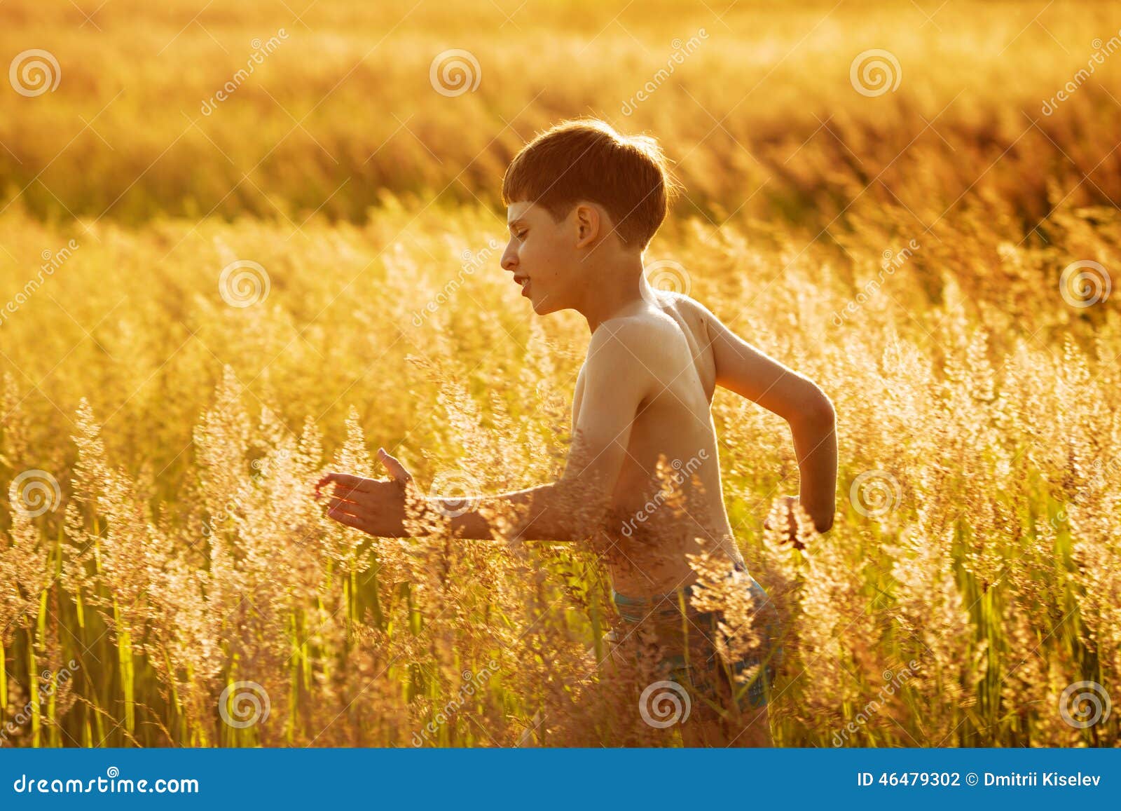 Happy Boy Running in a Field Stock Photo - Image of bliss, happiness ...