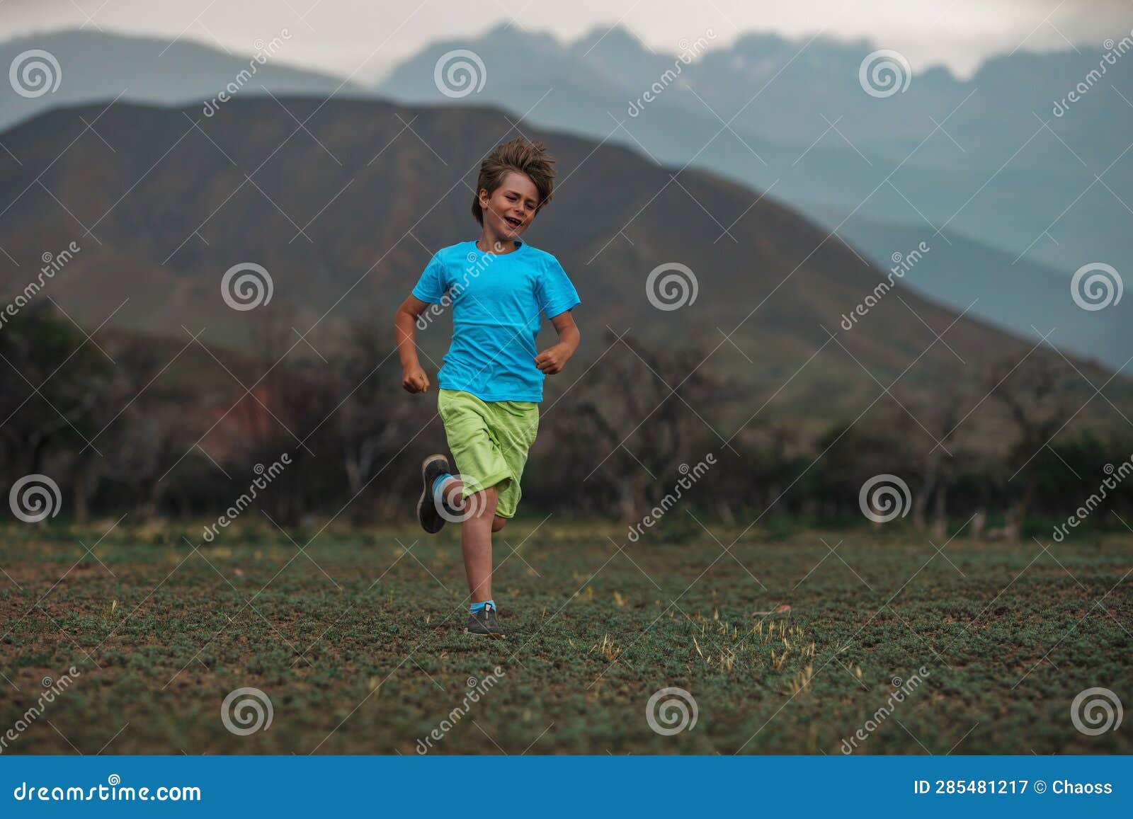 Happy Boy Running on Mountains Background Stock Image - Image of ...