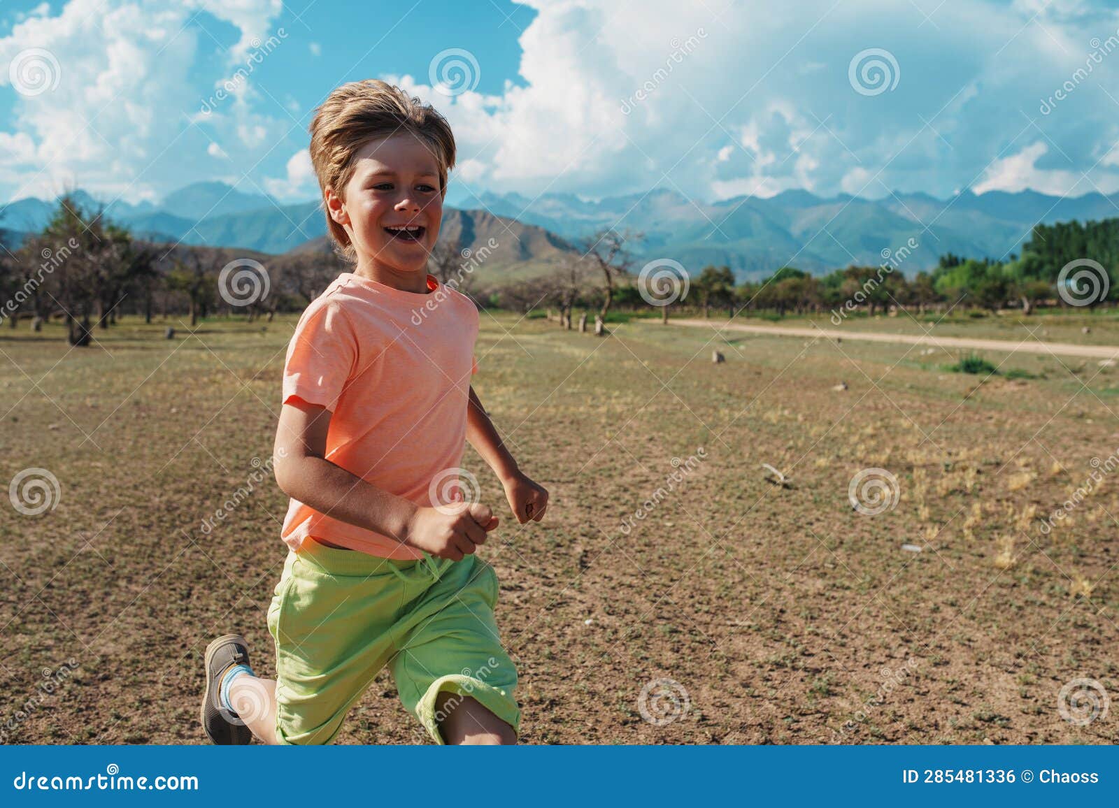Happy Boy Running on Mountains Background Stock Photo - Image of ...