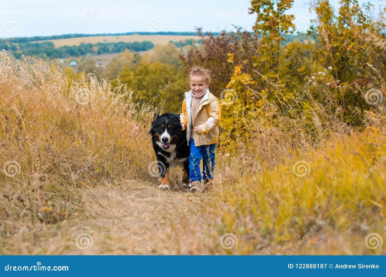 Happy Boy Runs Around with Big Dog on Autumn Hills of Race Stock Image ... Happy Boy Runs Around with Big Dog on Autumn Hills of Race Stock Image ...