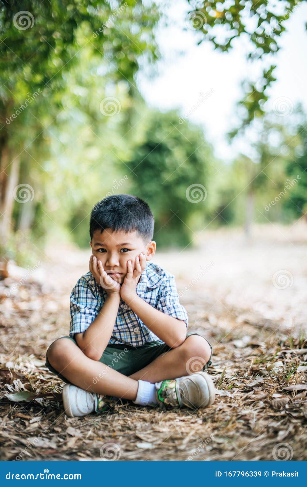 Happy Boy Sitting and Thinking Alone Stock Image - Image of outdoor ...