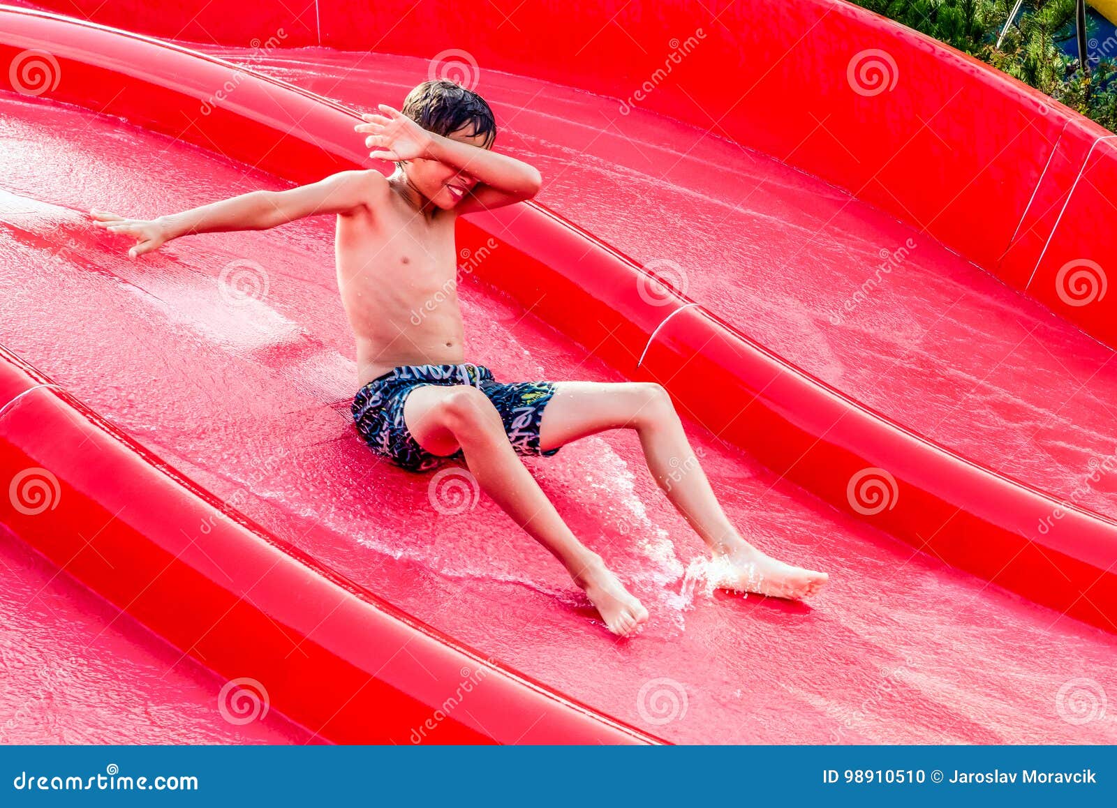 Boy Sliding on a Water Slide Stock Photo - Image of beautiful, aquapark ... Boy Sliding on a Water Slide Stock Photo - Image of beautiful, aquapark ...