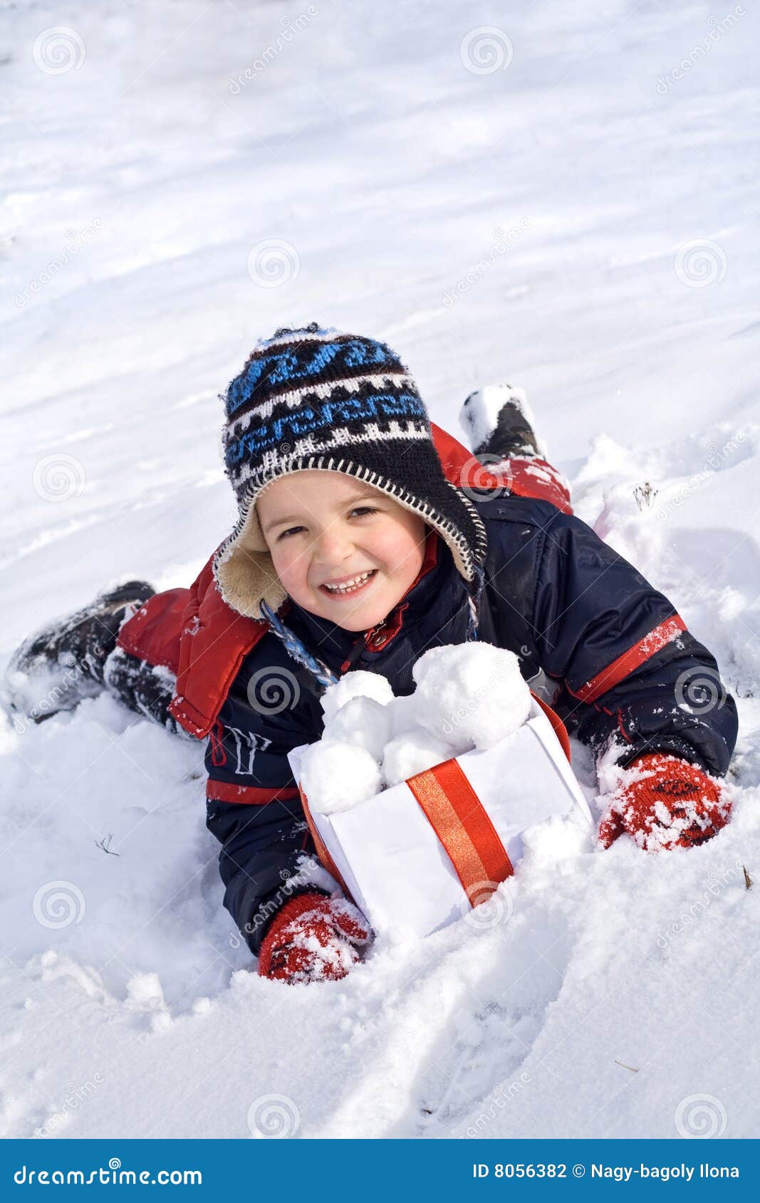 Happy Boy in the Snow with Snowballs in a Box Stock Photo - Image of ...