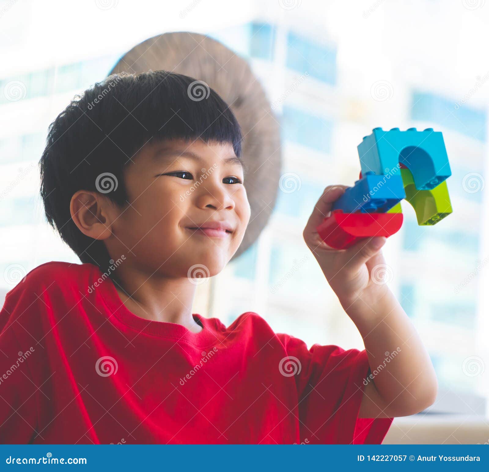 Boy Stacking Toy Blocks on a Living Room for Educational Toy Stock ...
