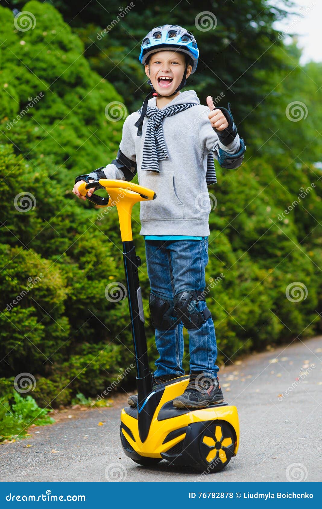 Happy Boy Standing on Hoverboard or Gyroscooter Outdoor Stock Photo ...