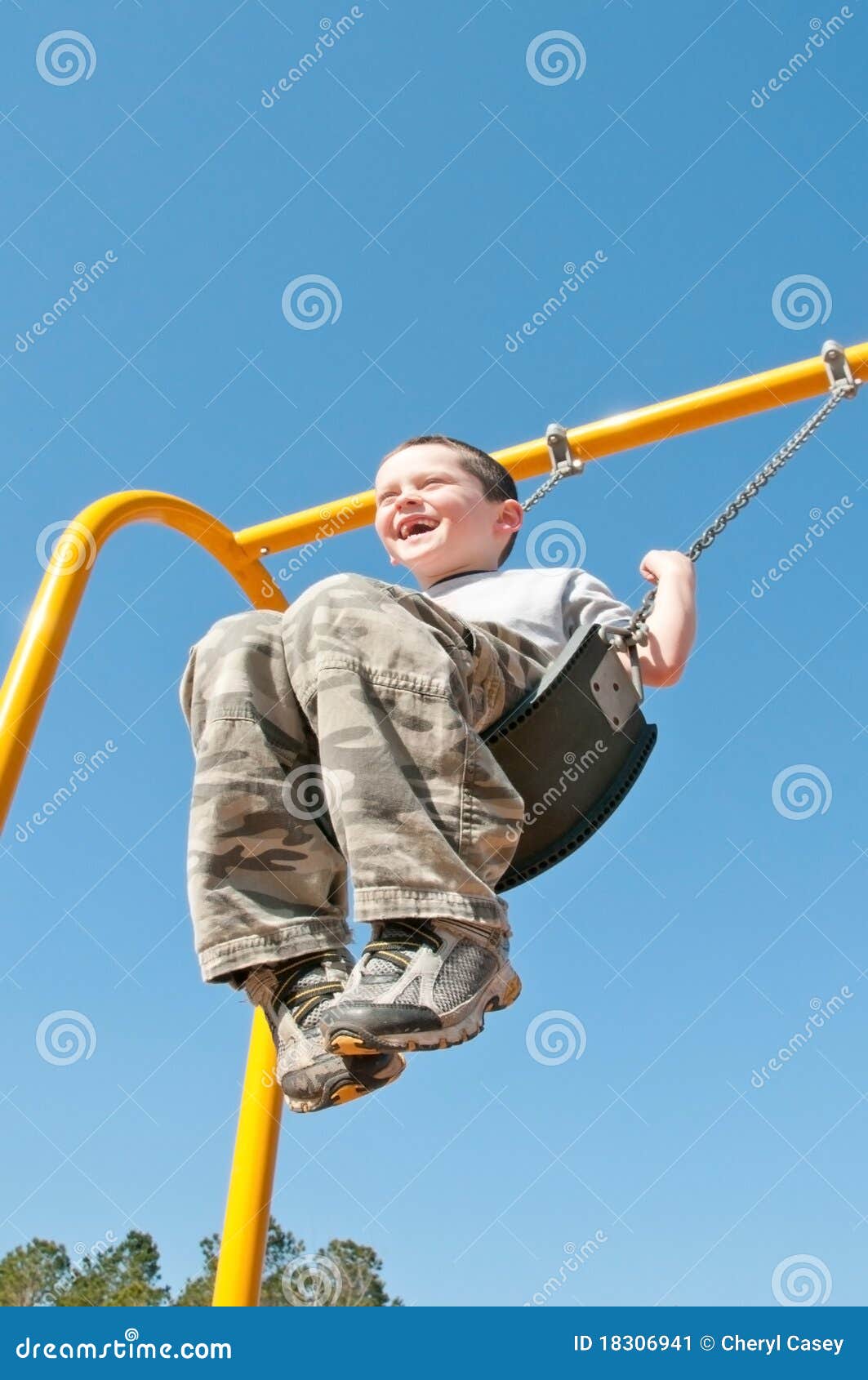 Happy boy on swing stock image. Image of smiling, park - 18306941