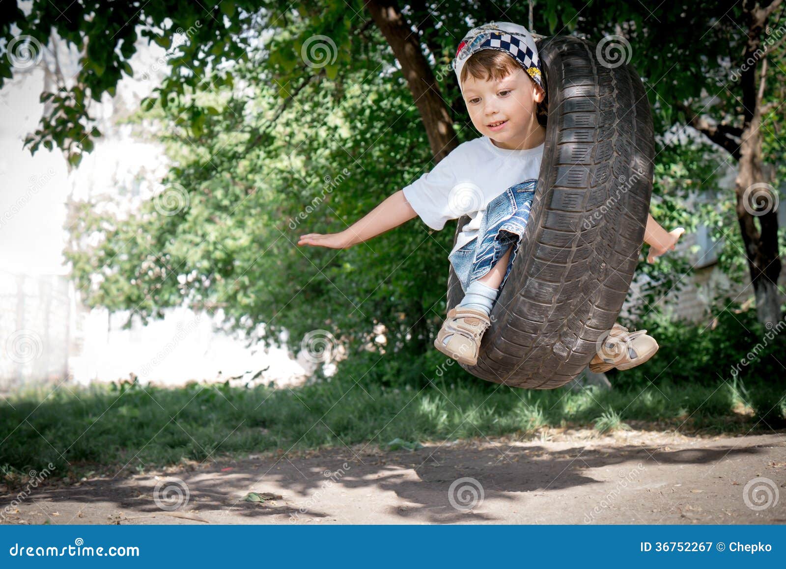 Happy boy on swing stock image. Image of laughing, nature - 36752267