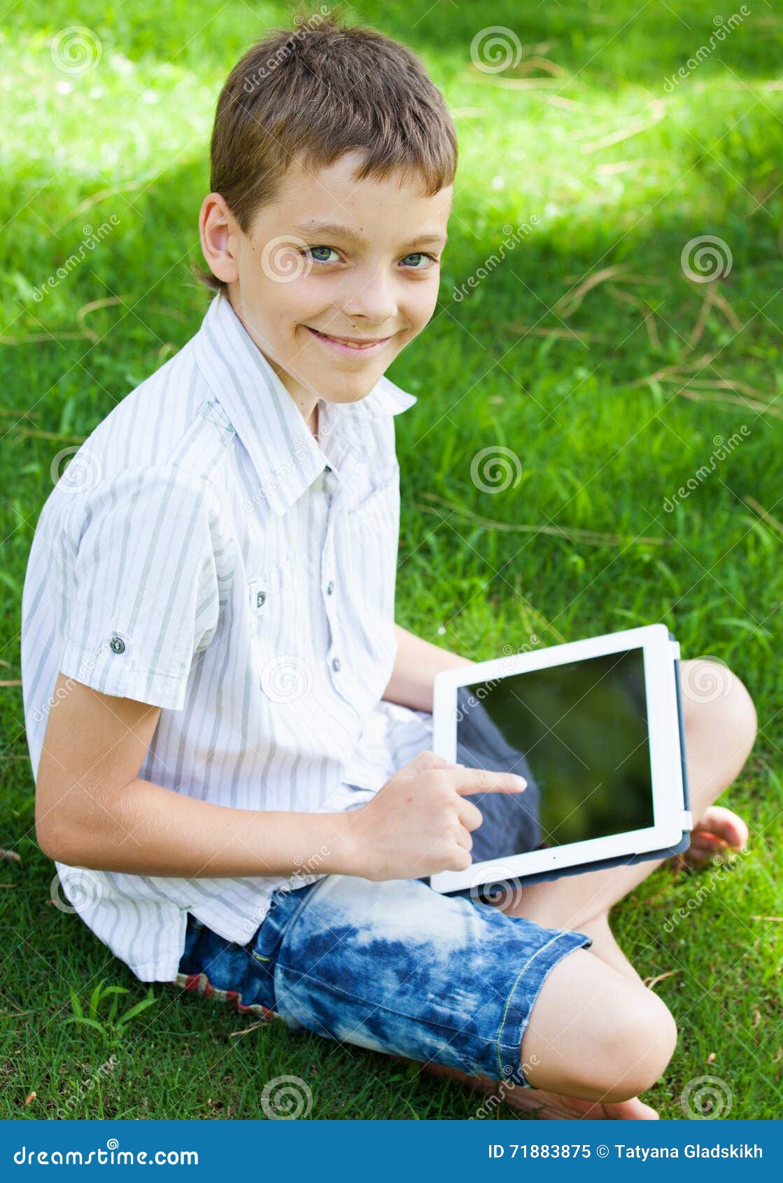 Happy boy with tablet stock image. Image of lawn, lifestyles - 71883875