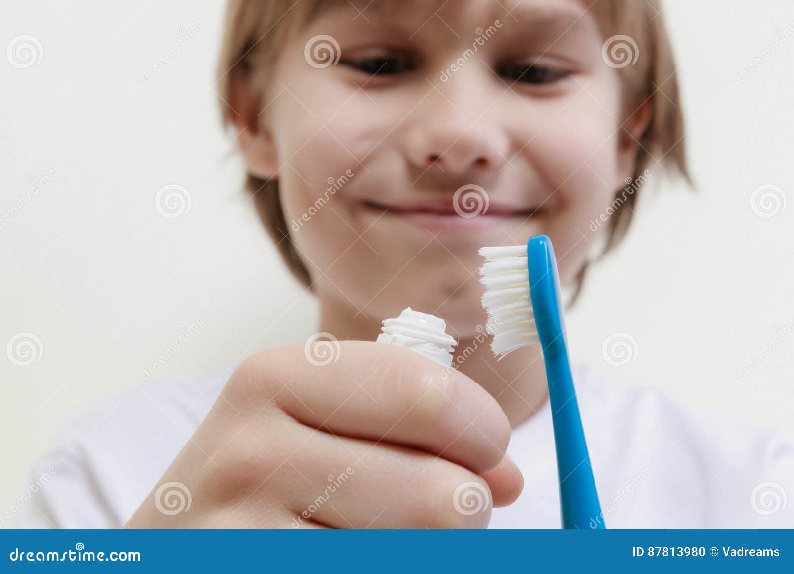 Happy Boy Taking Toothpaste and Preparing To Brush His Teeth with ...